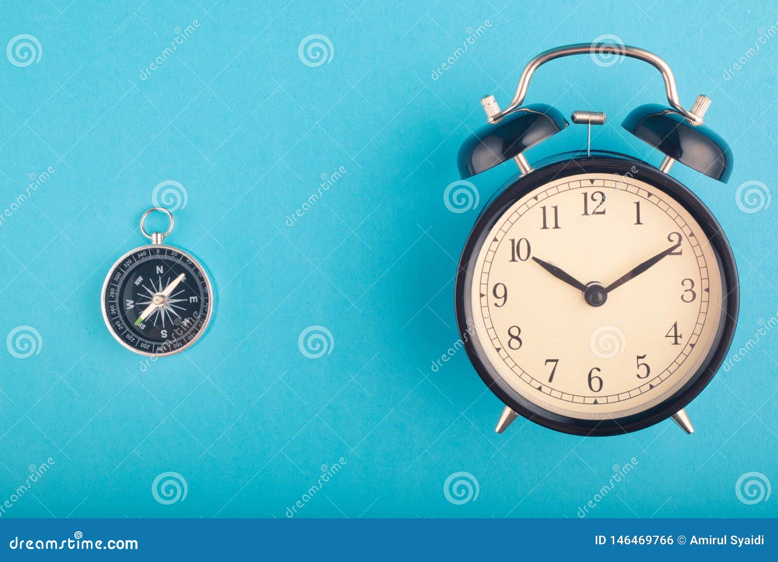 Time Management Concept, Alarm Clock and Compass on Blue Background ...