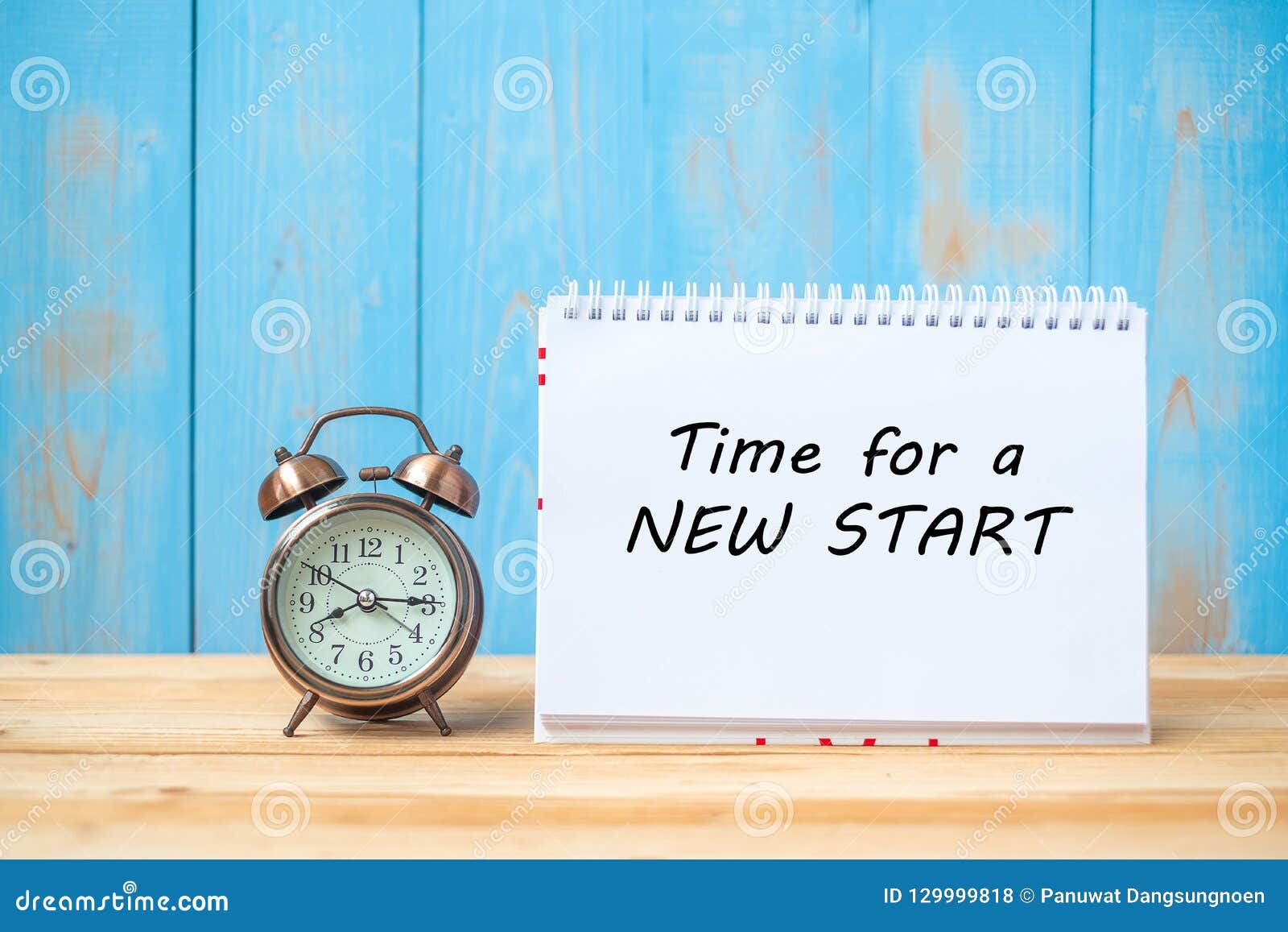 Time for a New Start Text on Notebook and Retro Alarm Clock on Table ...