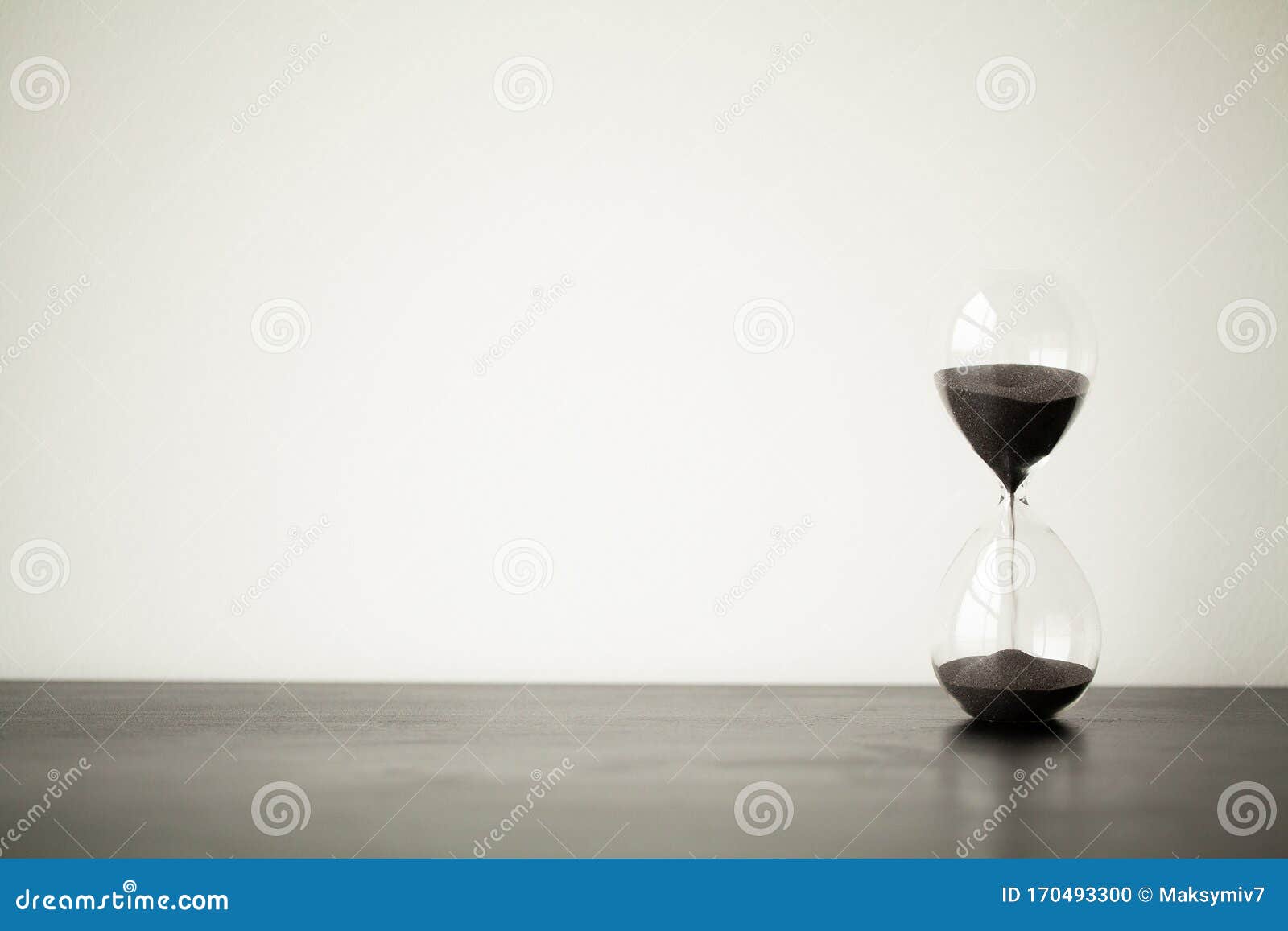 Time Passing. a Side View of an Hourglass with Falling Sand Stock Photo ...