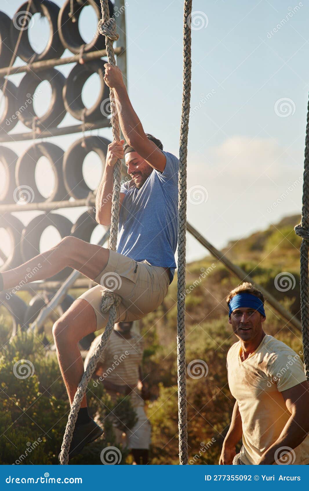 Time To Challenge Yourself. a Group of Men Going through an Obstacle ...