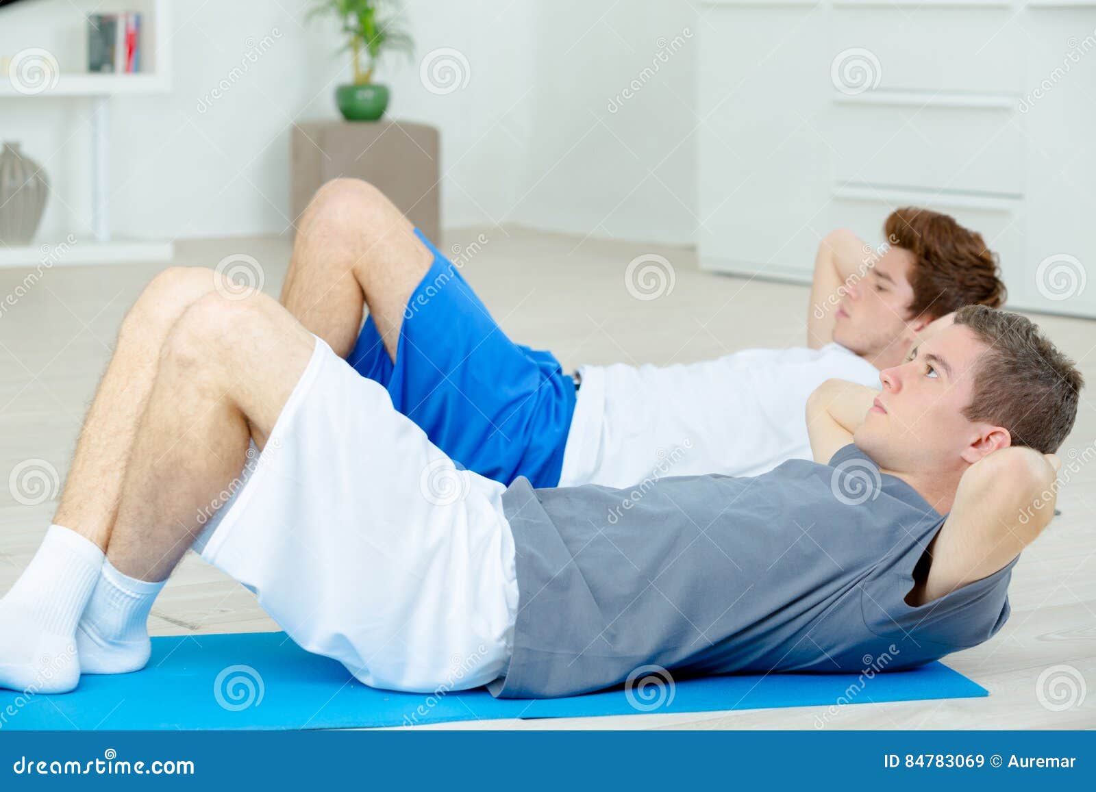 Time to do sit-ups stock image. Image of muscular, home - 84783069