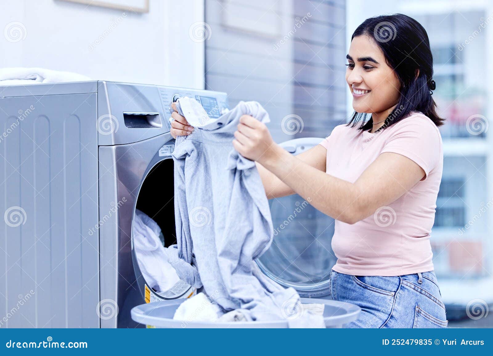 Time To Do Some Laundry. a Young Woman Doing Laundry at Home. Stock ...