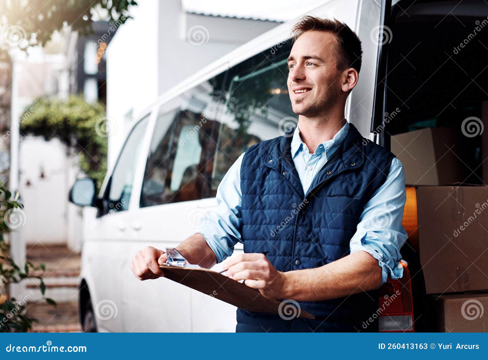 Time To Get Some Deliveries Done. a Courier Checking His Deliveries in ...