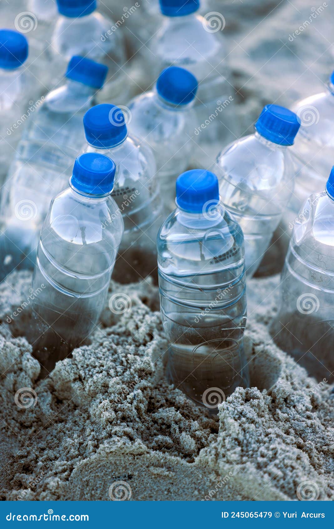 Time To Put a Cap on Pollution. Shot of Bottles Laying on the Beach ...