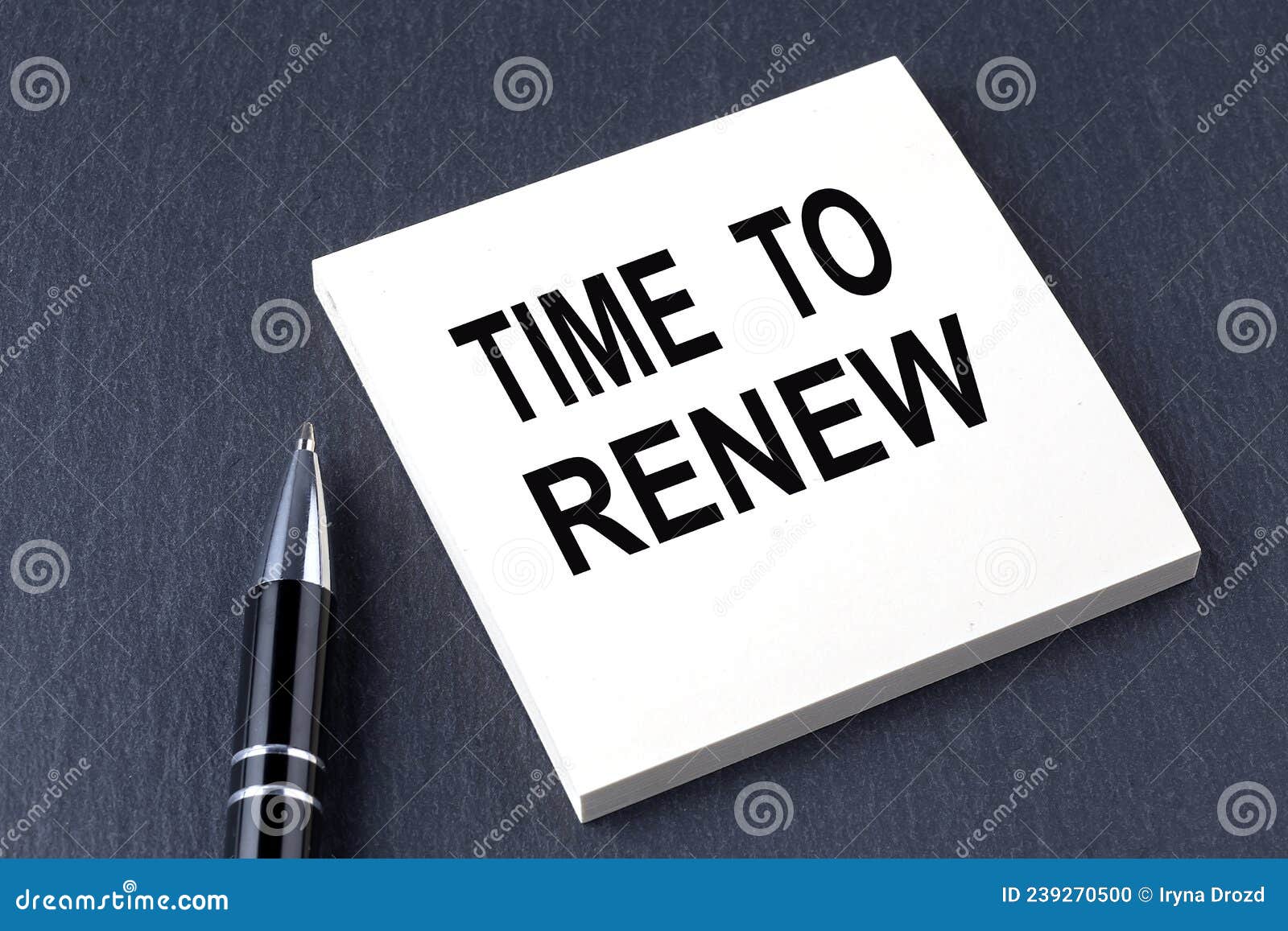 TIME TO RENEW Text on the Sticker with Pen on Black Background Stock ...