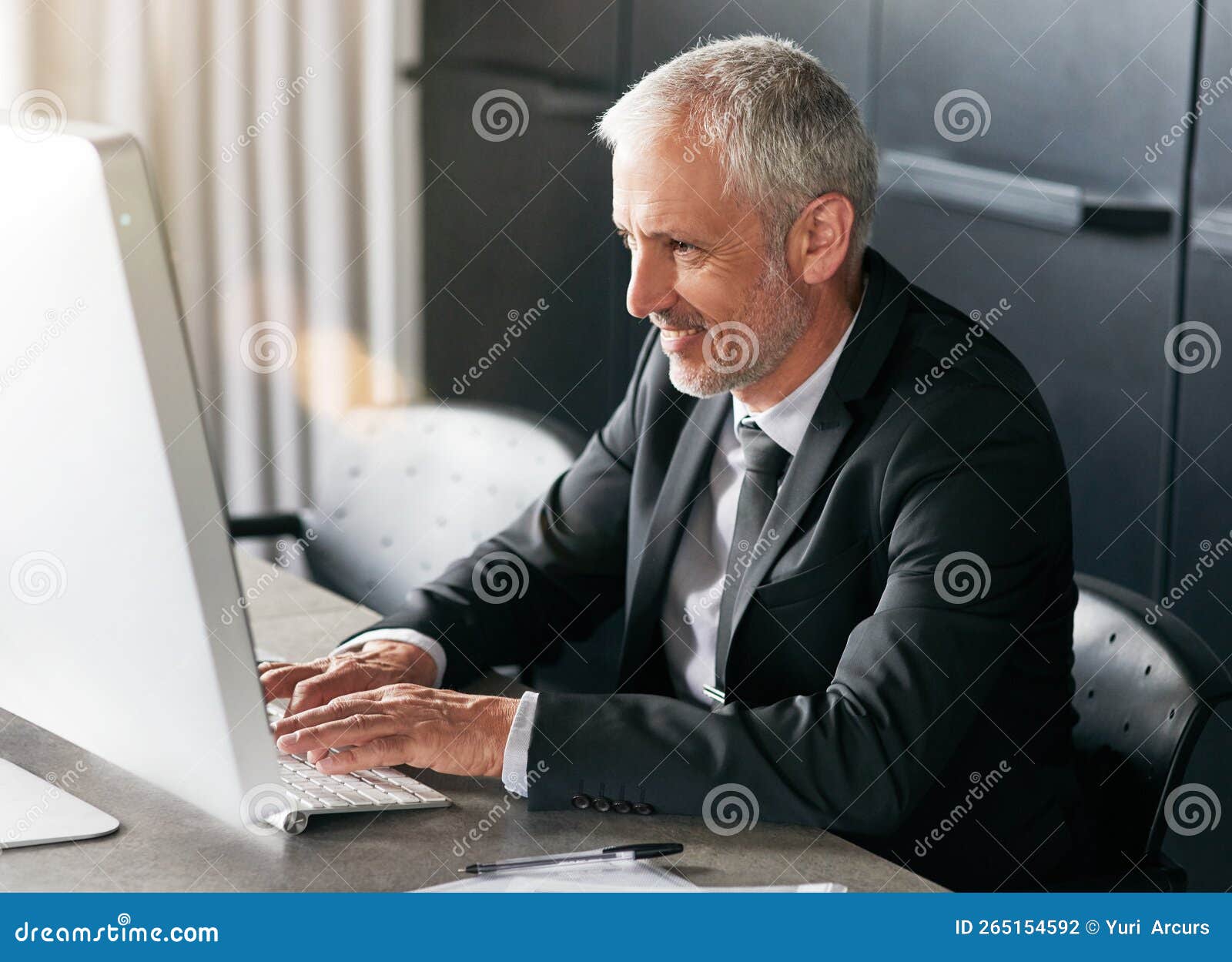 Time To Sit and Graph. a Handsome Mature Businessman Sitting Down and ...