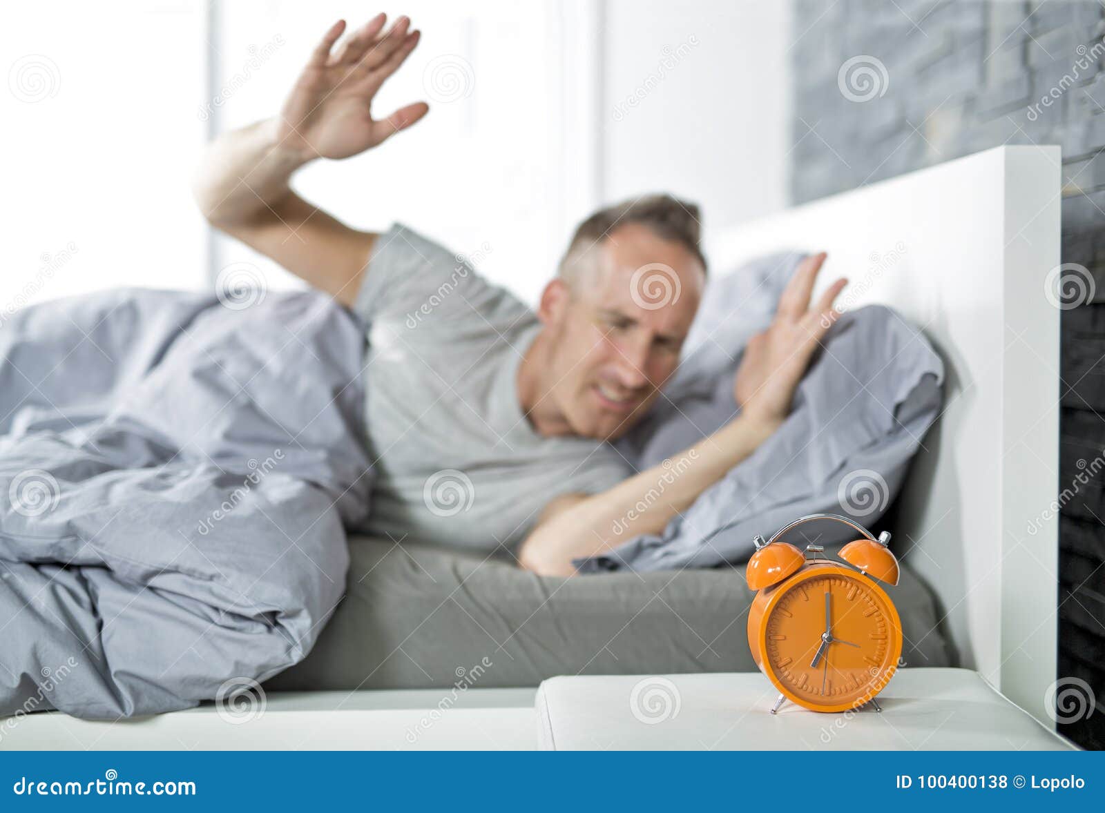 Time To Wake Up. Tired Man in the Bed Stock Photo - Image of reaching ...