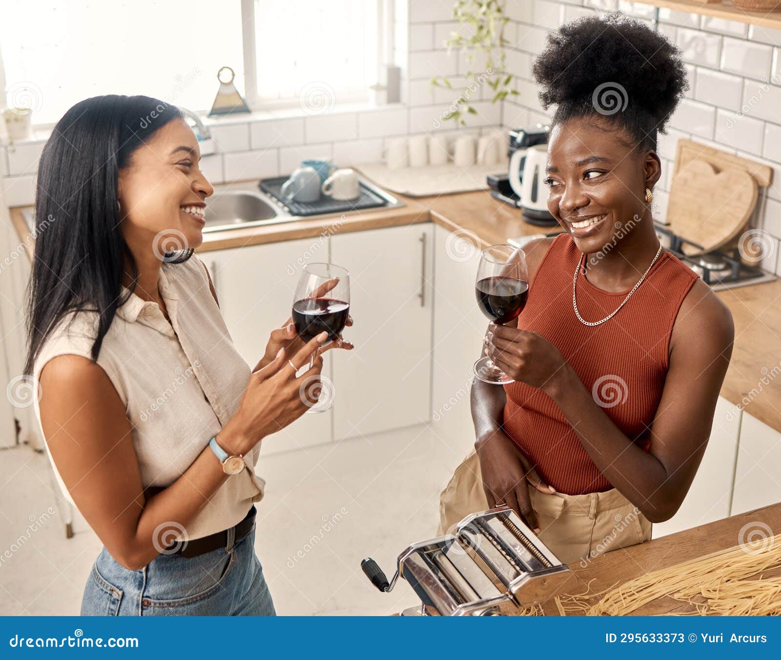 Time To Wine Down. Two Young Friends Drinking Wine Together at Home ...