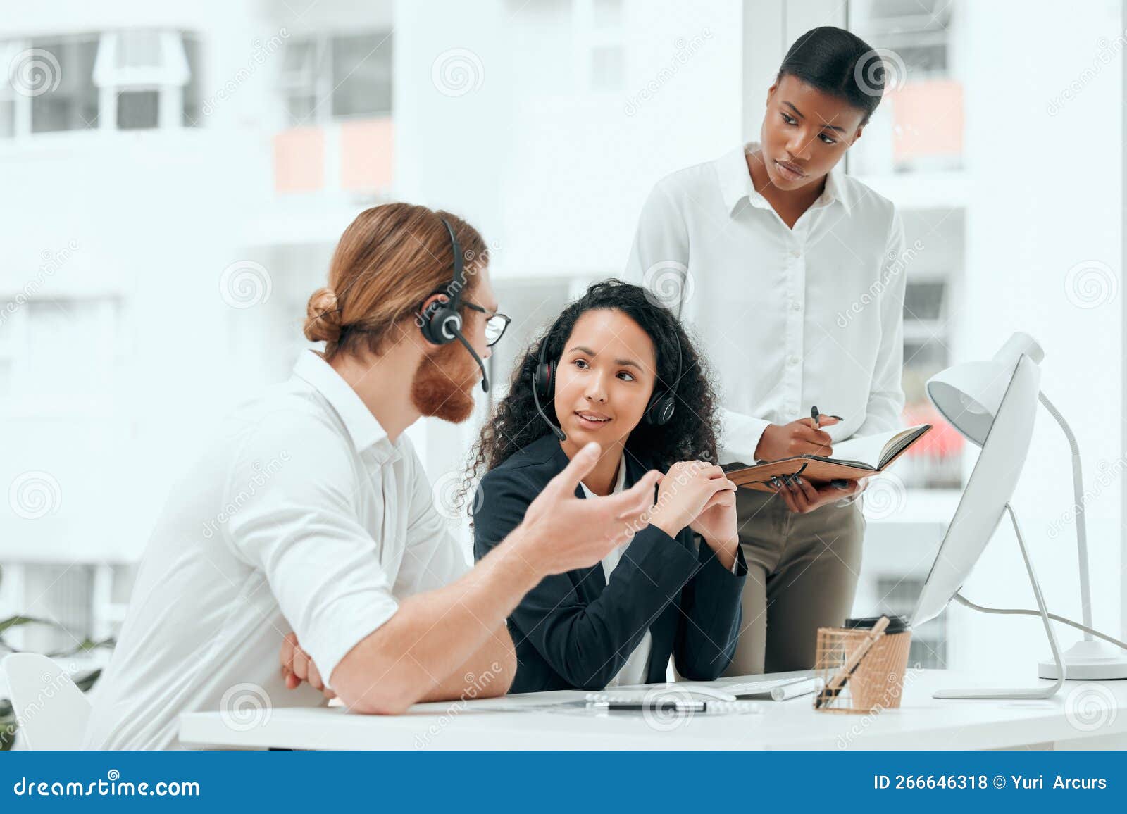 Time for Training. Two Young Call Center Agent and Their Supervisor ...