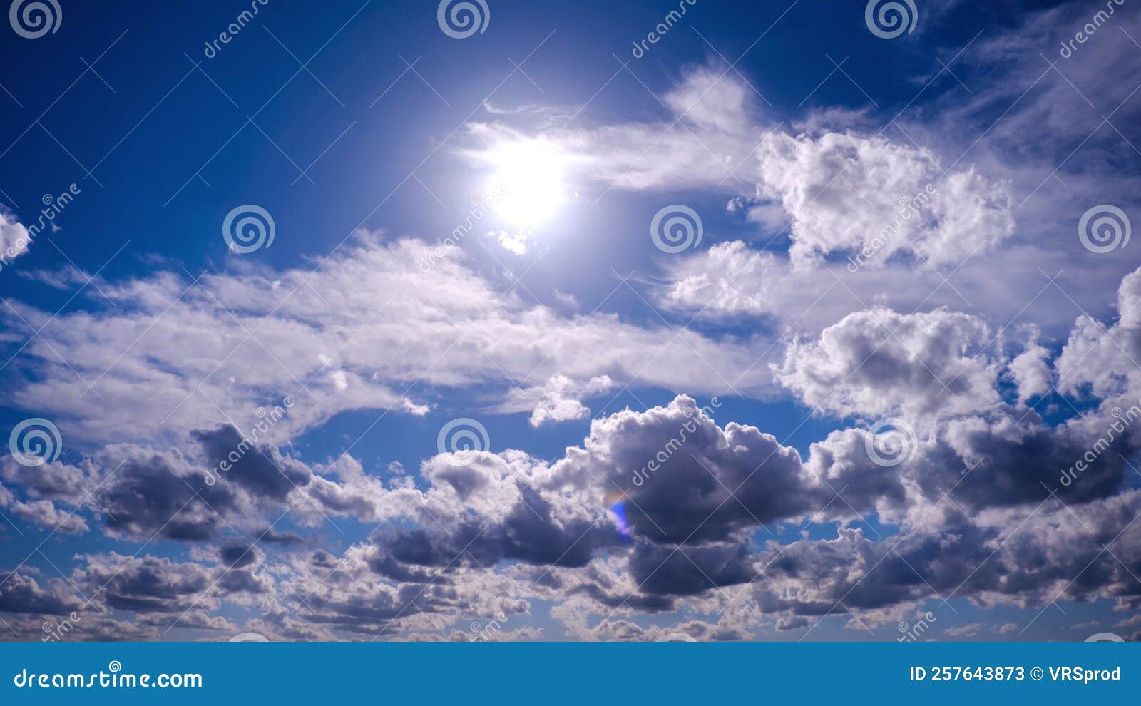 Timelapse of Fluffy Clouds Moving Under the Sun in the Blue Sky Stock ...