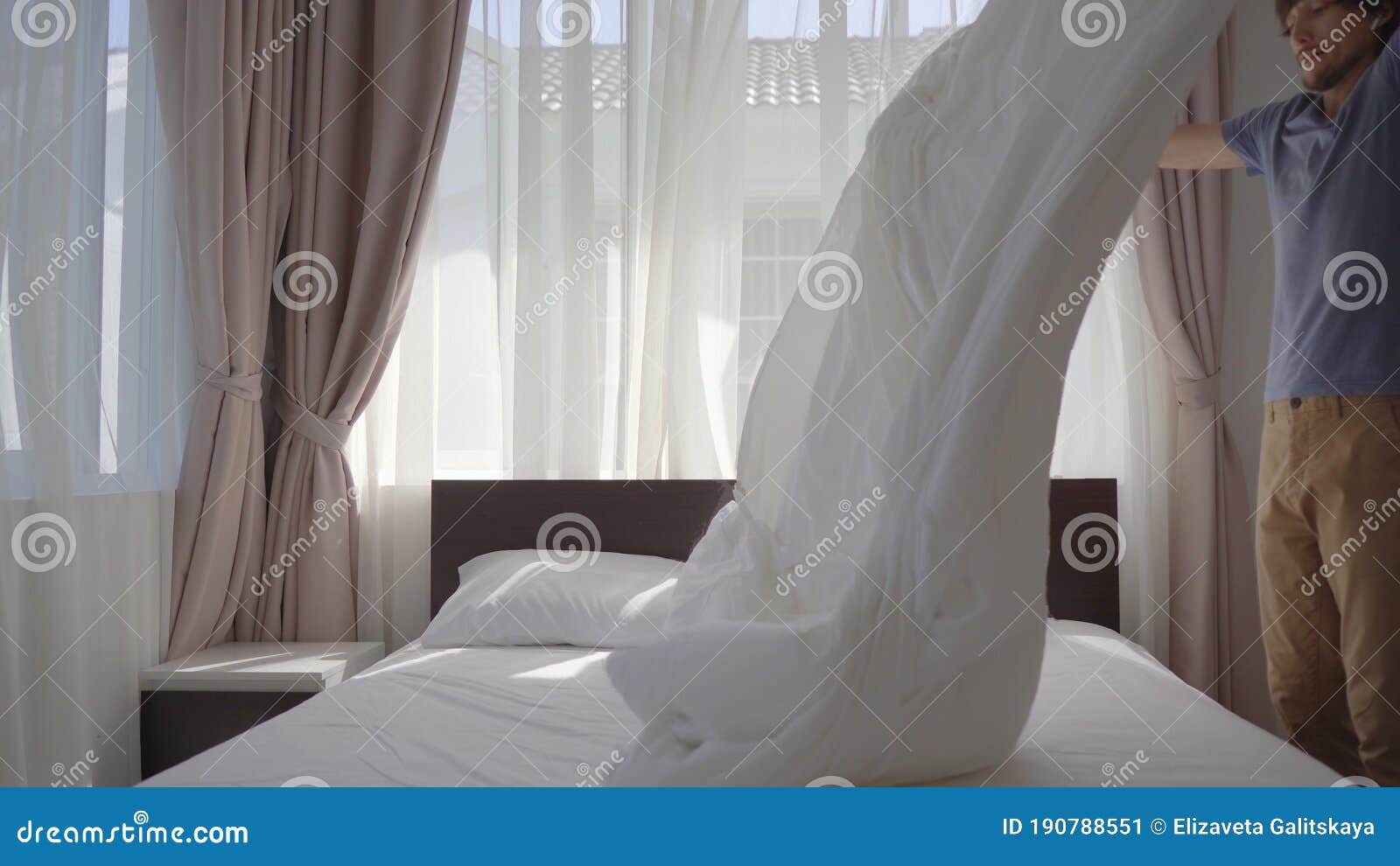 Timelapse Shot of a Young Man that Changes Bedding on the Bed Stock ...