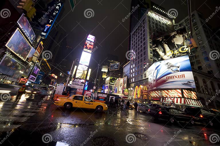 Times Square 3 editorial photo. Image of rain, tourists - 4707971