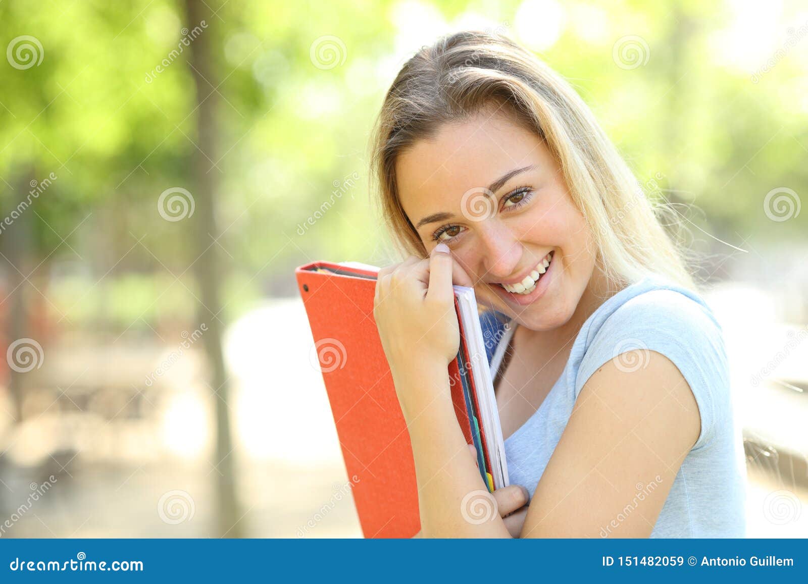 Timid Teenage Student Looking at Camera Stock Image - Image of folder ...