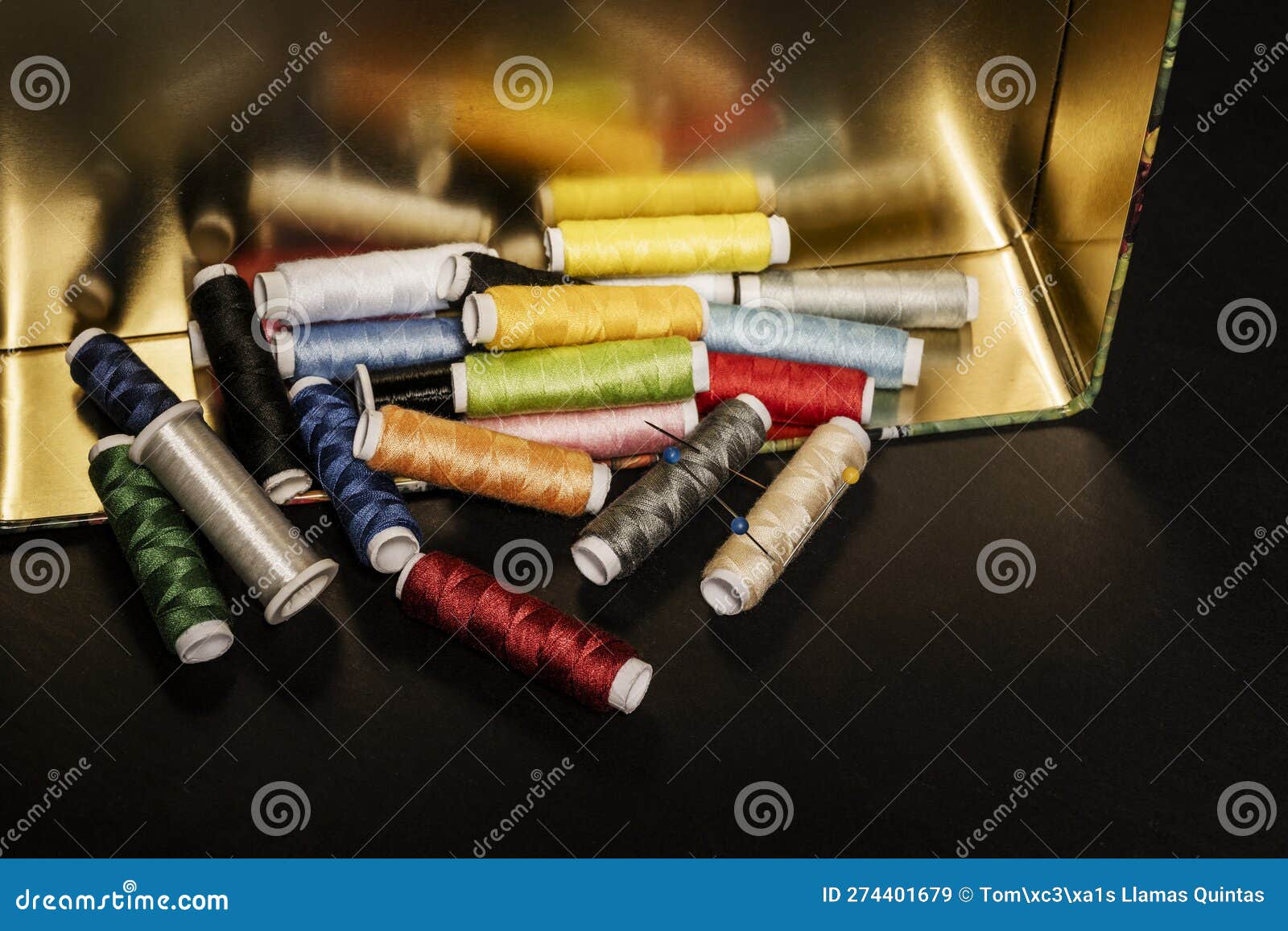 A Tin Box Full of Spools of Sewing Thread Upended on a Smooth Stock ...