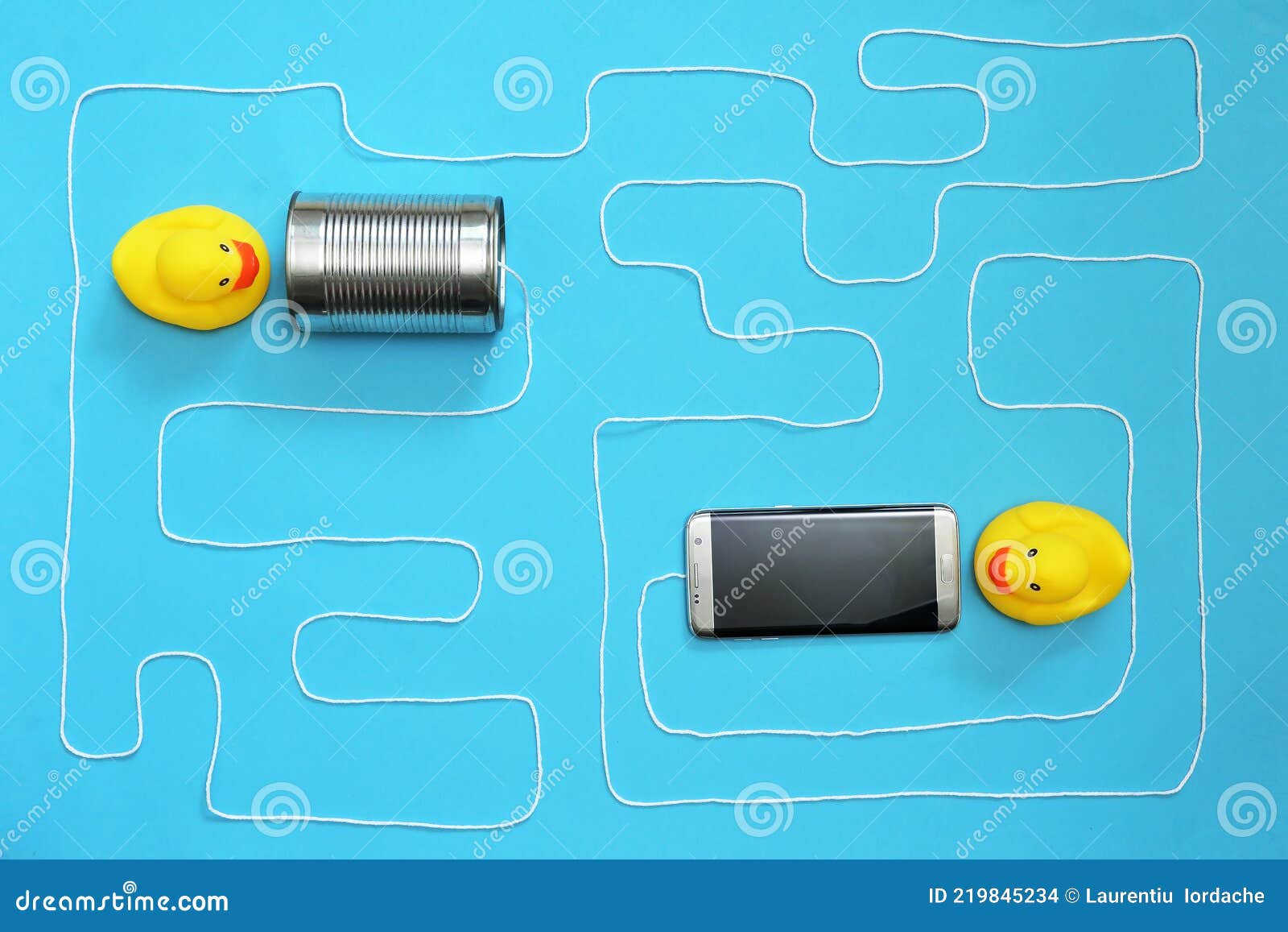 Tin Can Phone with String and Smartphone and Toy Ducks Stock Photo ...