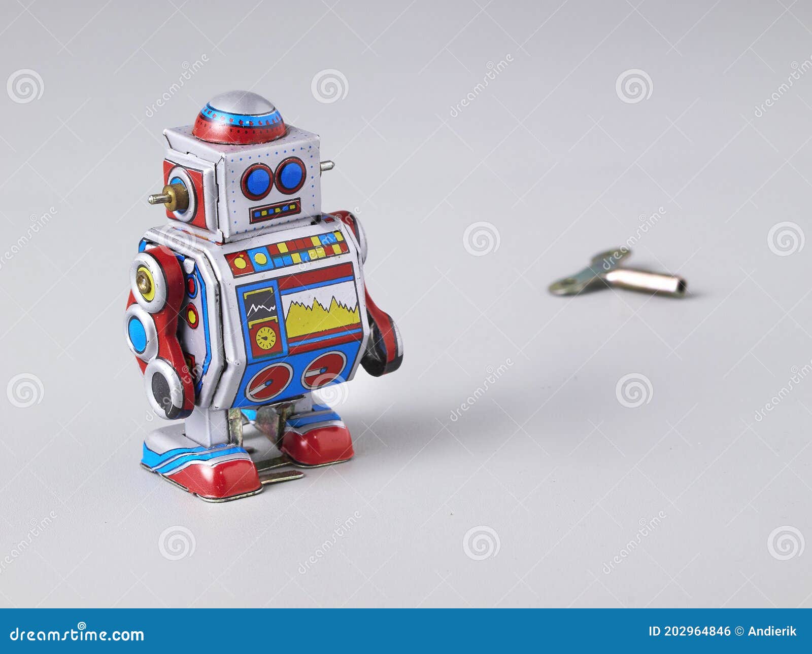 A Tin Toy Robot Standing with Its Key Released Stock Photo - Image of ...
