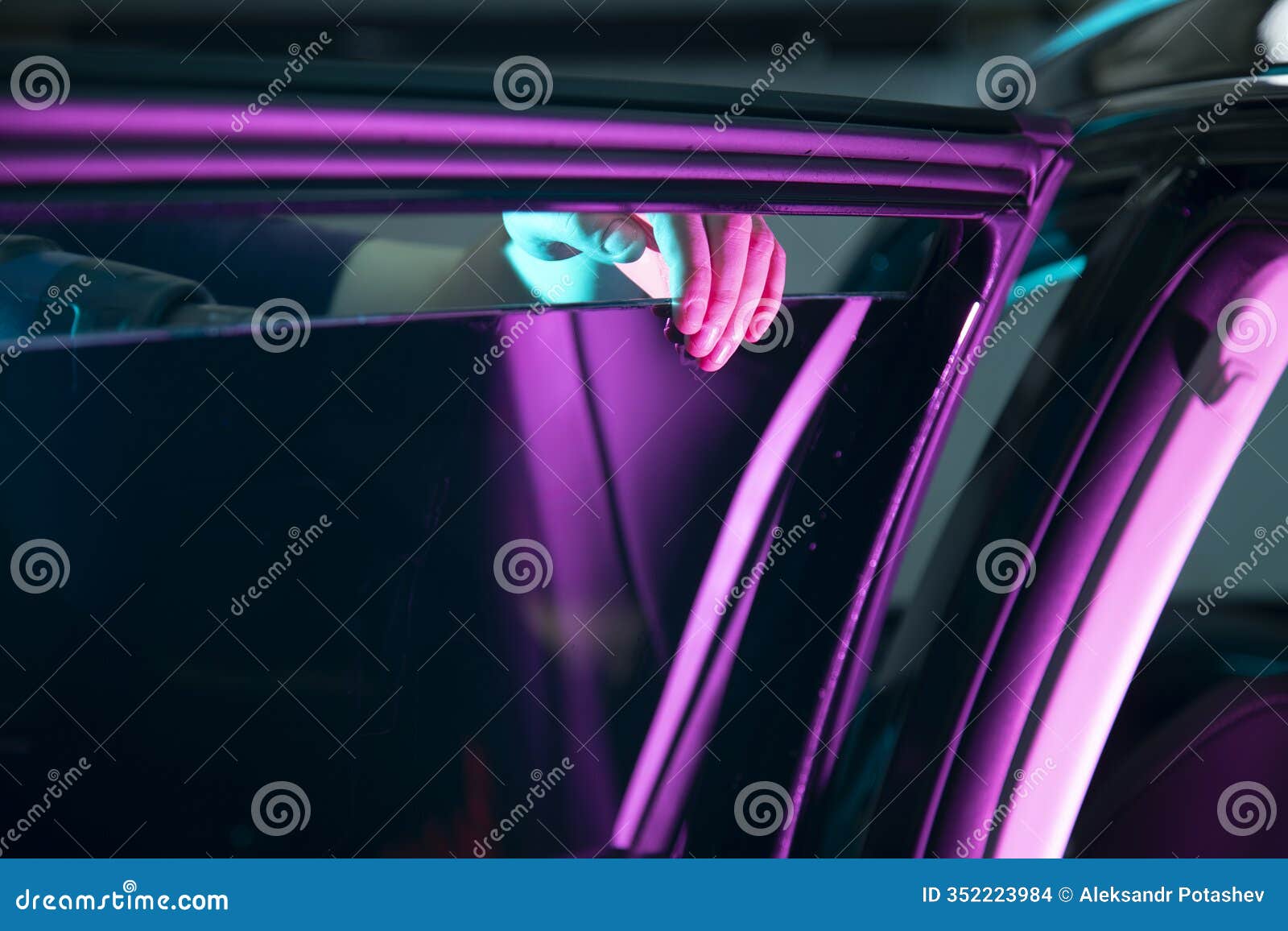 Tinting Car Windows in Neon Light.Window Film for the Car Stock Photo ...