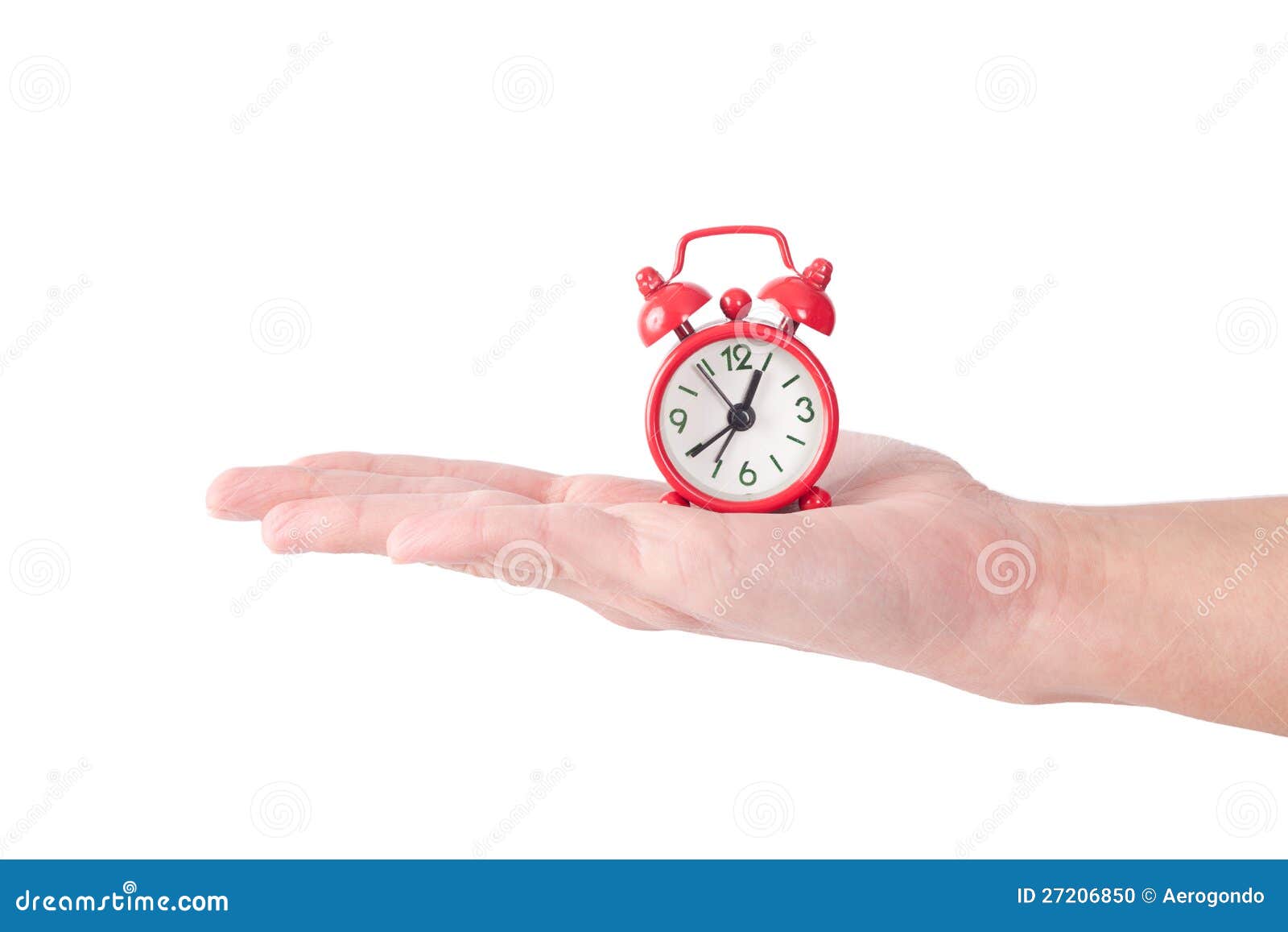 Tiny alarm clock in hand stock photo. Image of white - 27206850