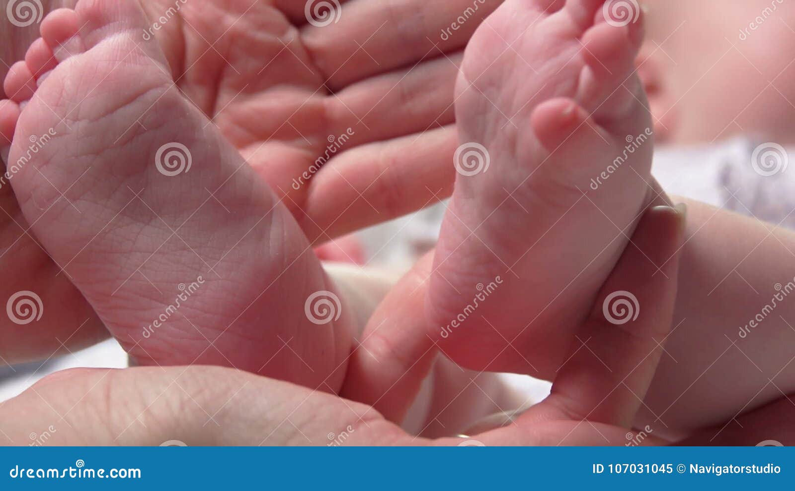 Baby feet in adult hands stock video. Video of innocence - 107031045