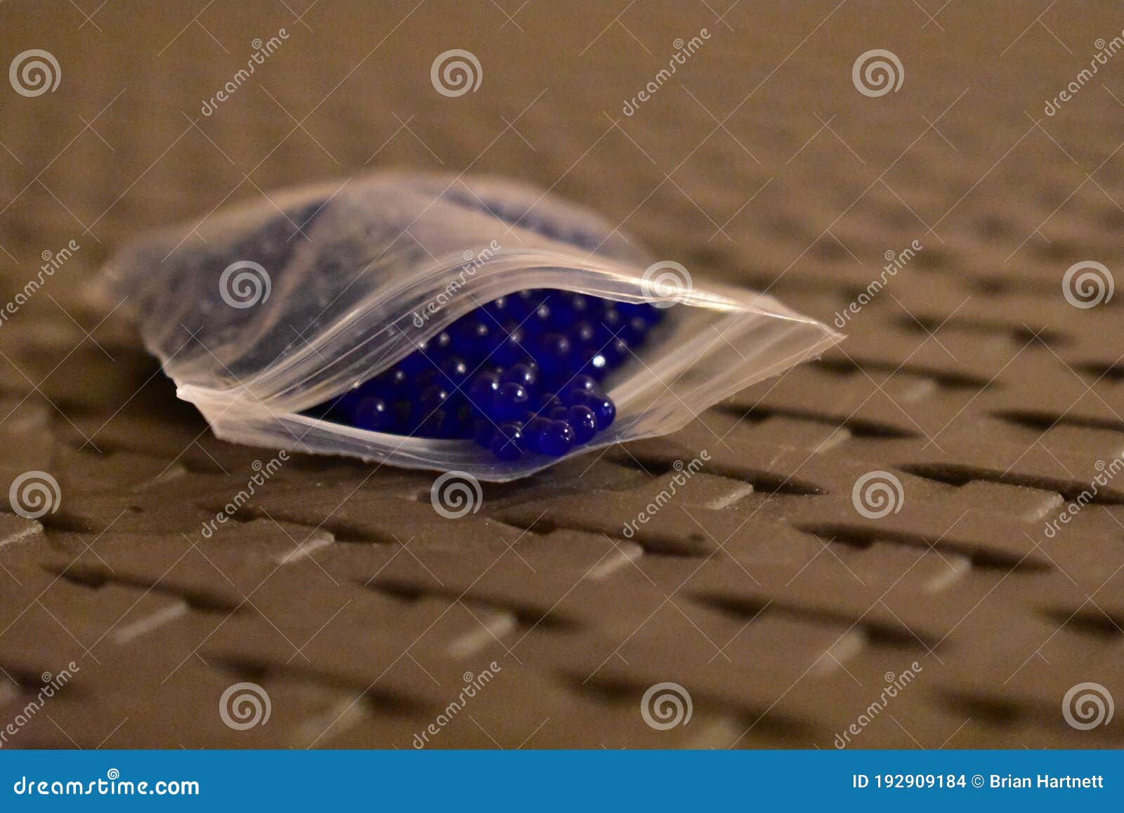 Tiny Blue Orbs in a Plastic Pouch Stock Photo - Image of bright, marble ...