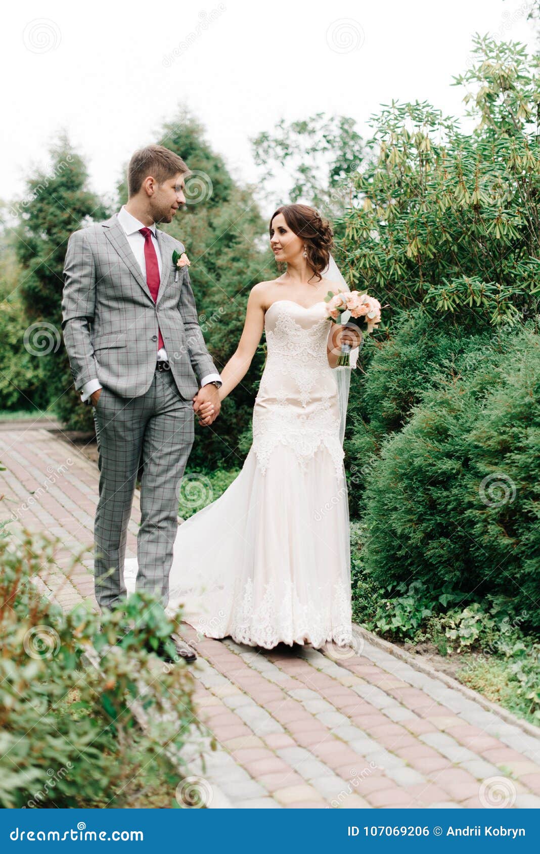 Tiny Bride and Groom in Grey Bouquet Walk Along the Path Stock Photo ...