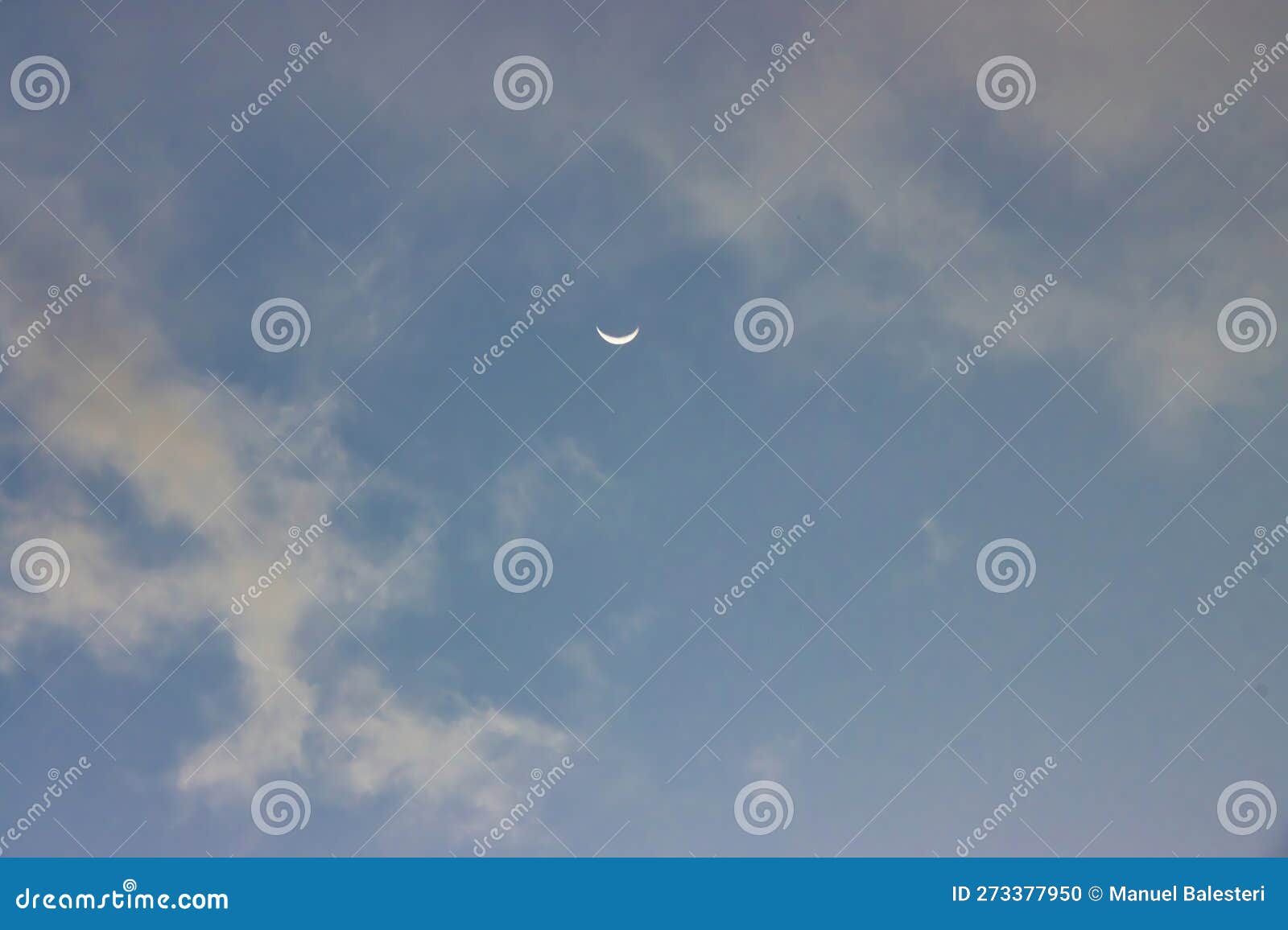 Tiny Crescent Moon Against a Blue Sky. Stock Photo - Image of tiny ...