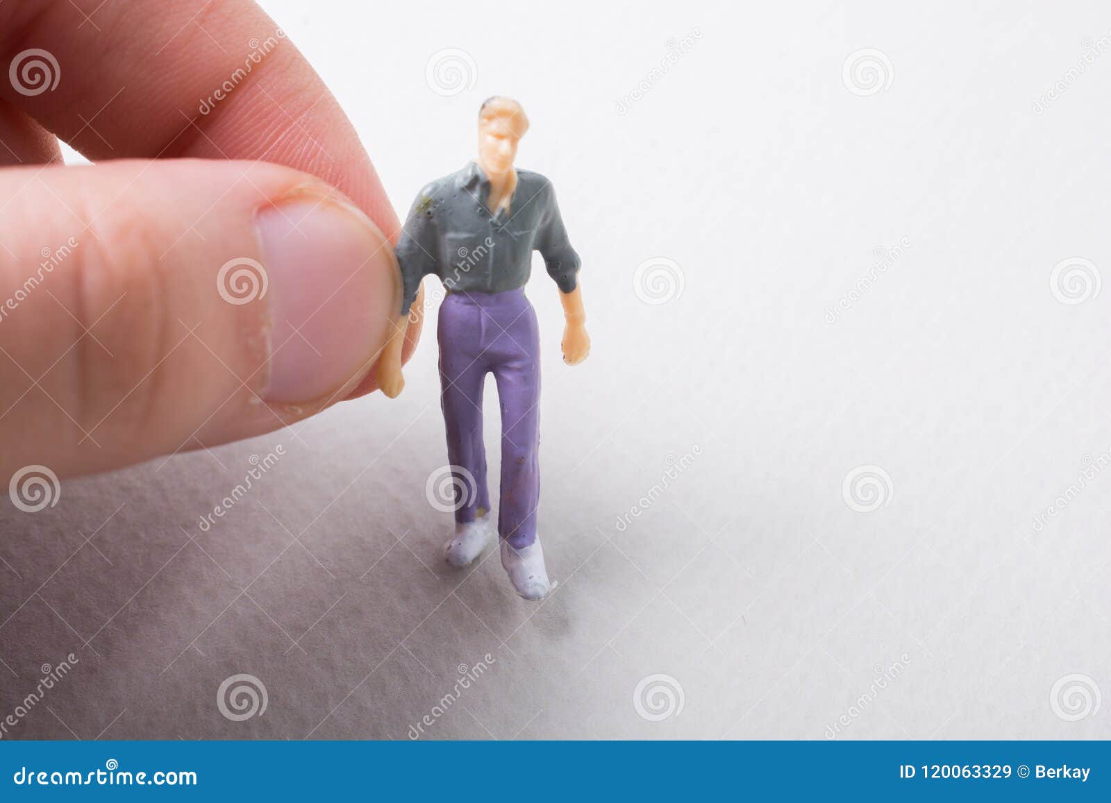 Tiny Figurine of Man Model in Hand Stock Image - Image of doll ...