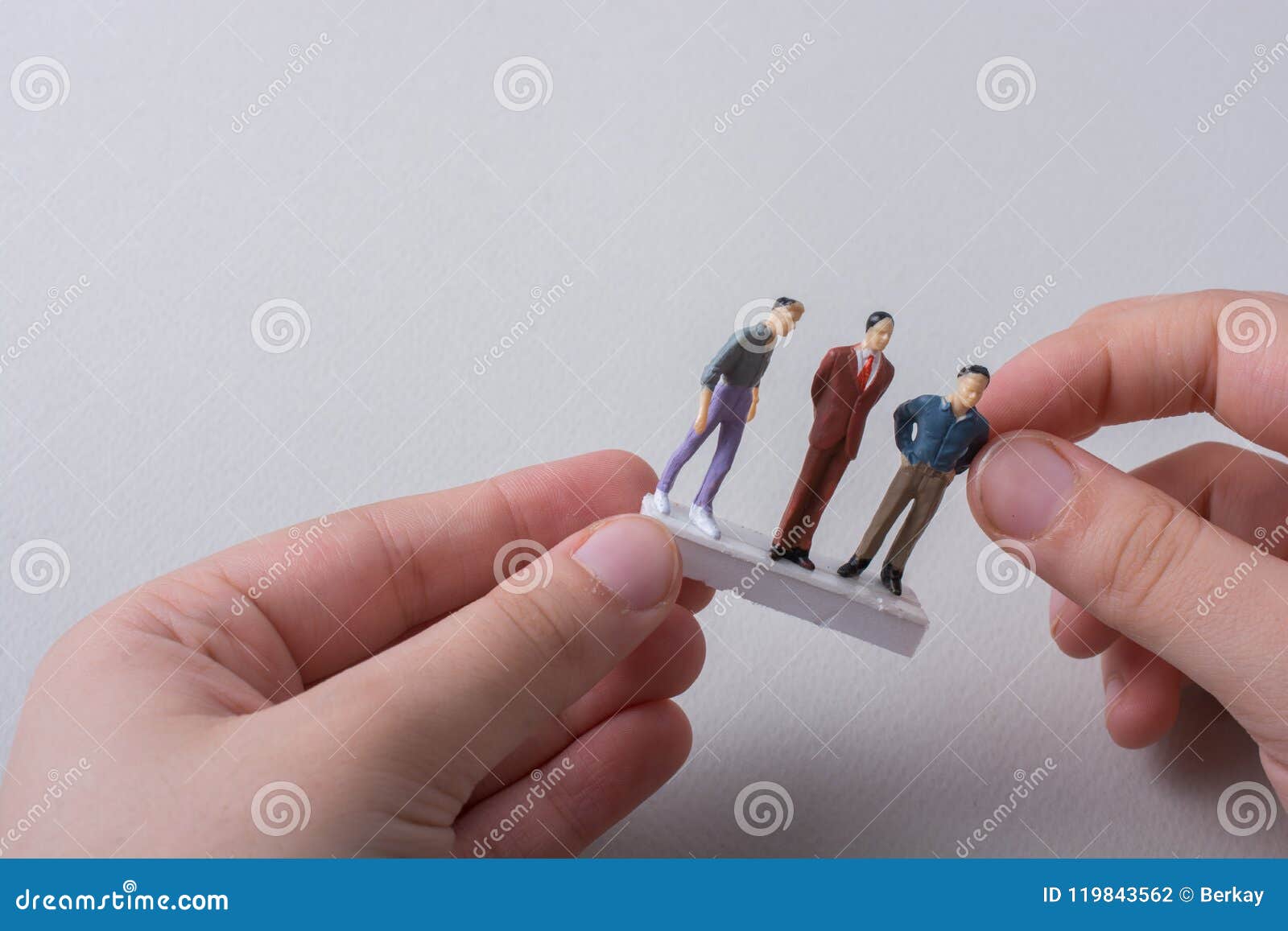 Tiny Figurine of Man Model in View Stock Photo - Image of male, hands ...
