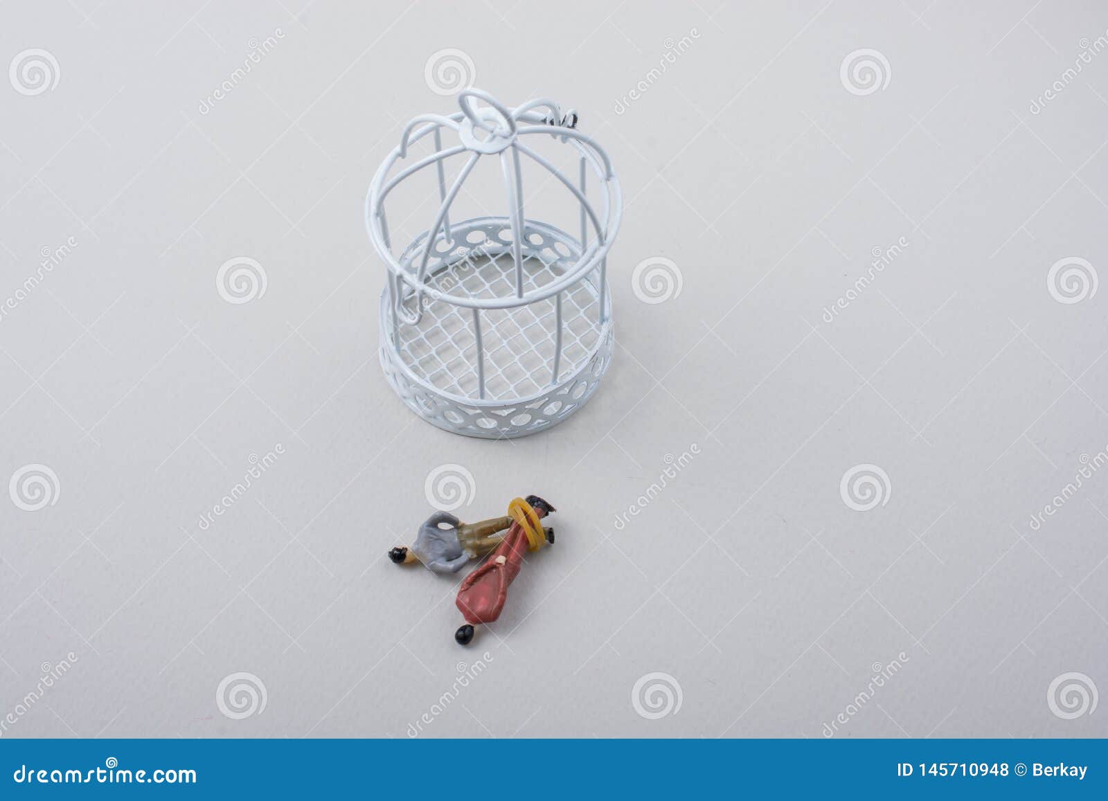 Tiny Figurine of Men Model Tied in Rope by Cage Stock Photo - Image of ...