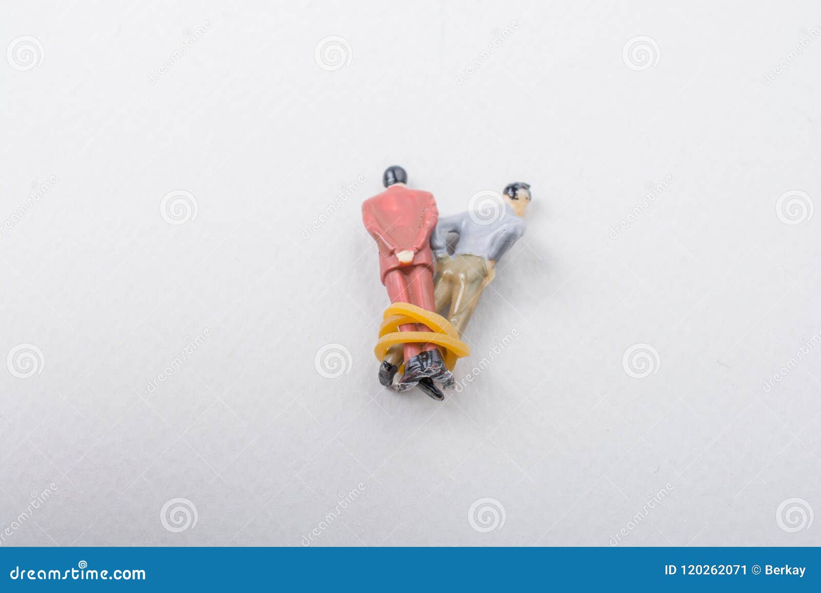 Tiny Figurine of Men Model Tied in Rope Stock Image - Image of figure ...