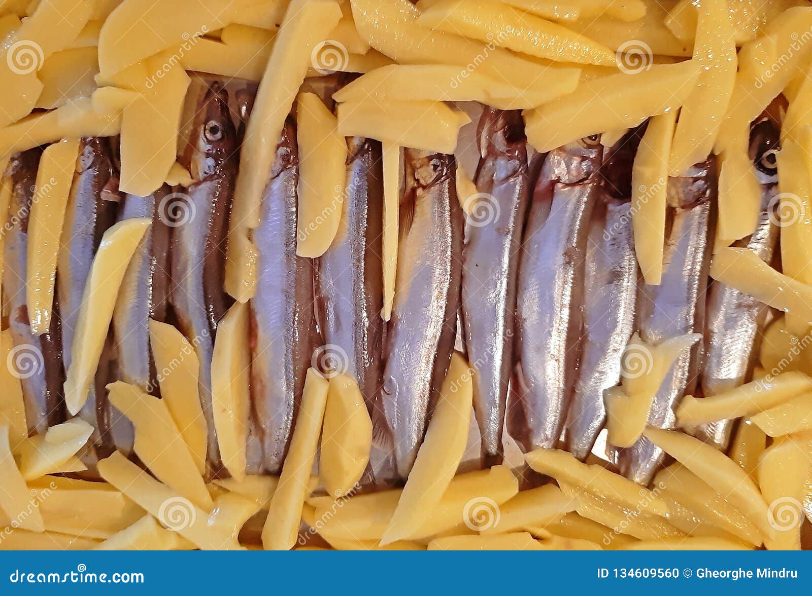 Tiny Fish with Sliced Potatoes Great Food Stock Photo - Image of ...