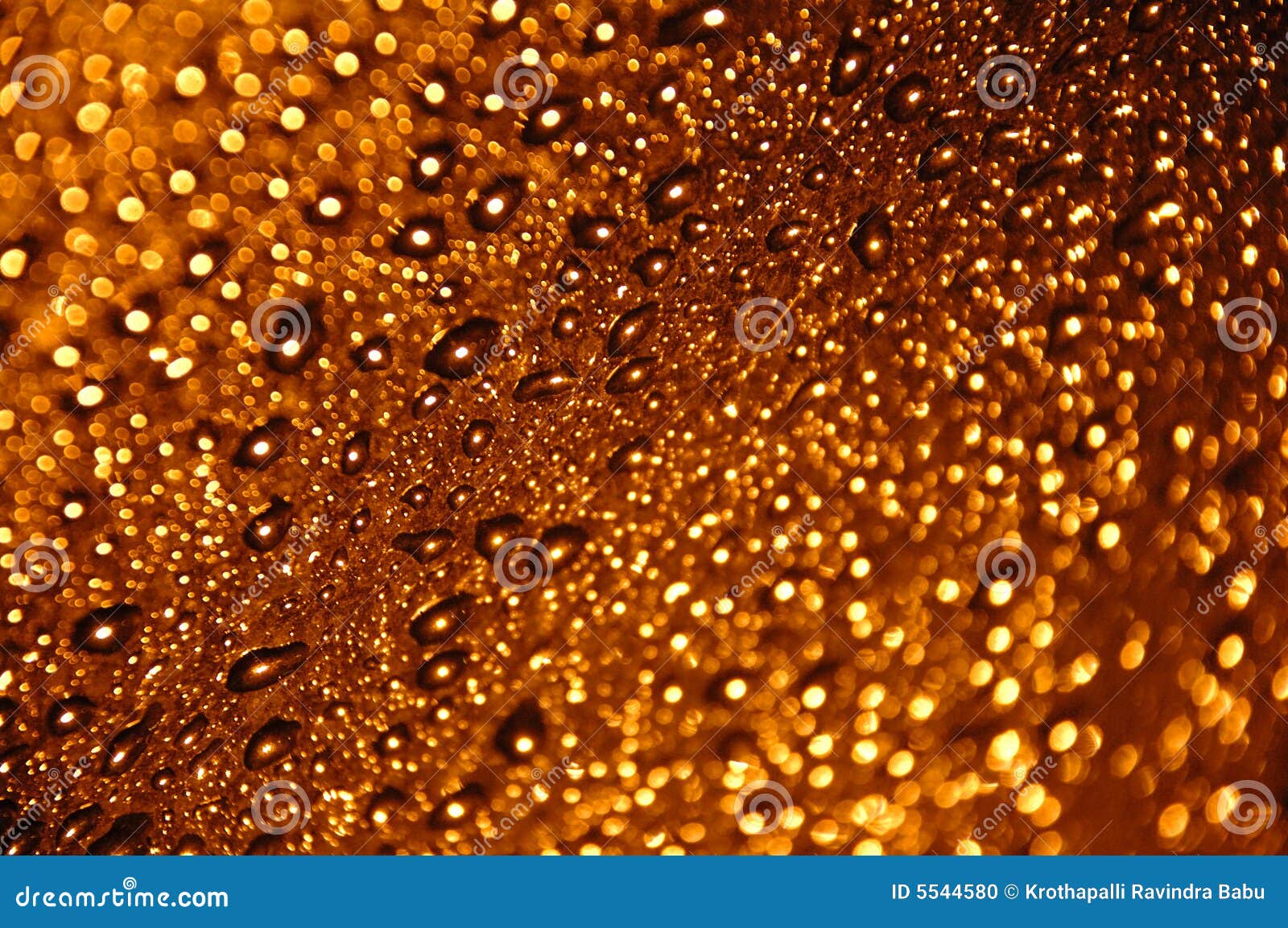 Tiny gold water drops stock photo. Image of bright, golden - 5544580