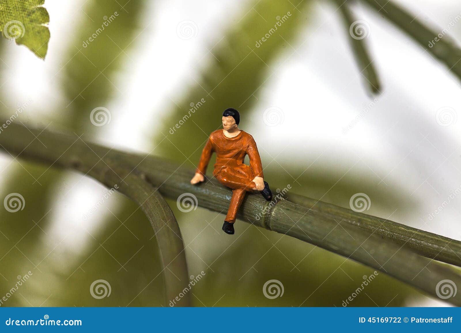 Tiny Man Sitting on a Branch Stock Photo - Image of closeup, situation ...