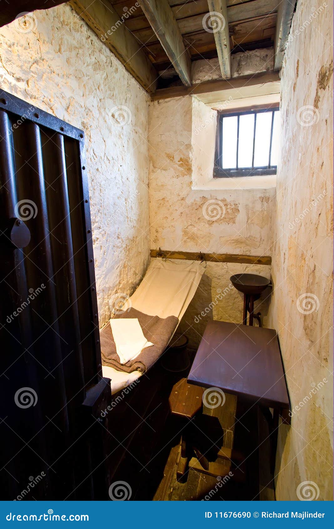 Tiny old prison cell stock photo. Image of table, walls - 11676690