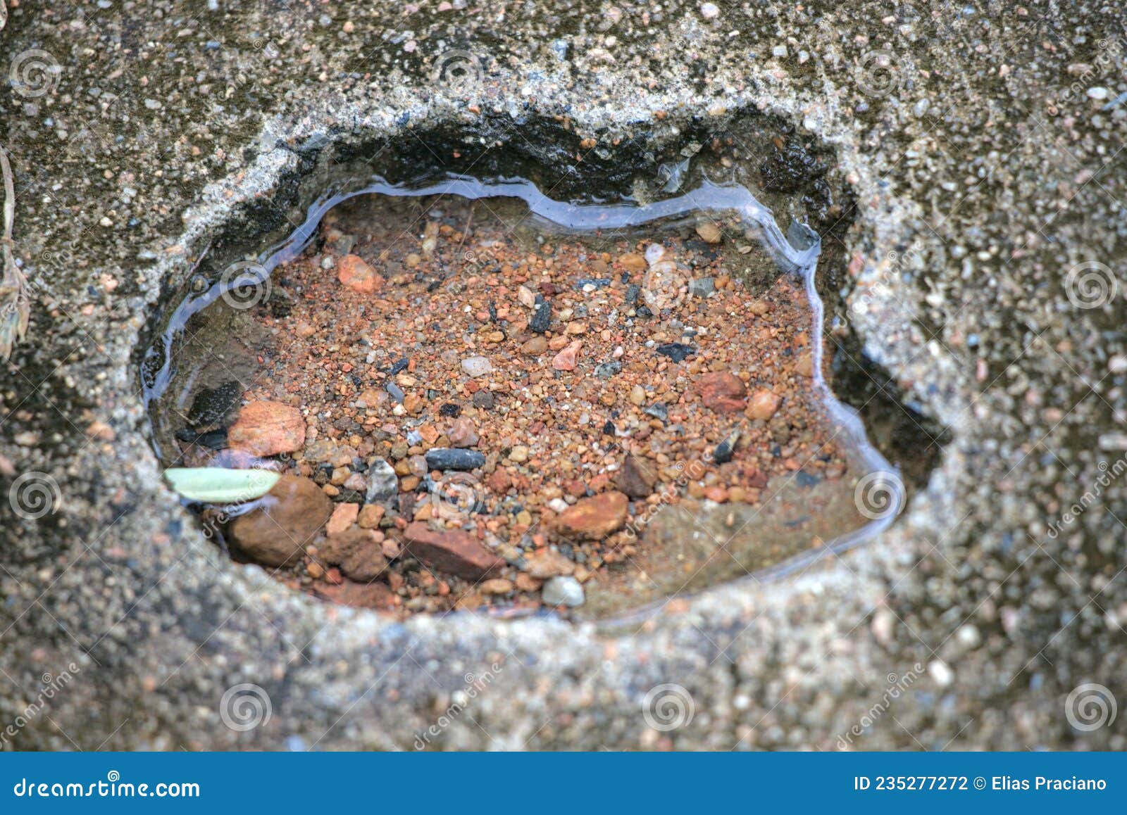 Tiny Puddle of Water in a Hole. Stock Photo - Image of stones, patience ...