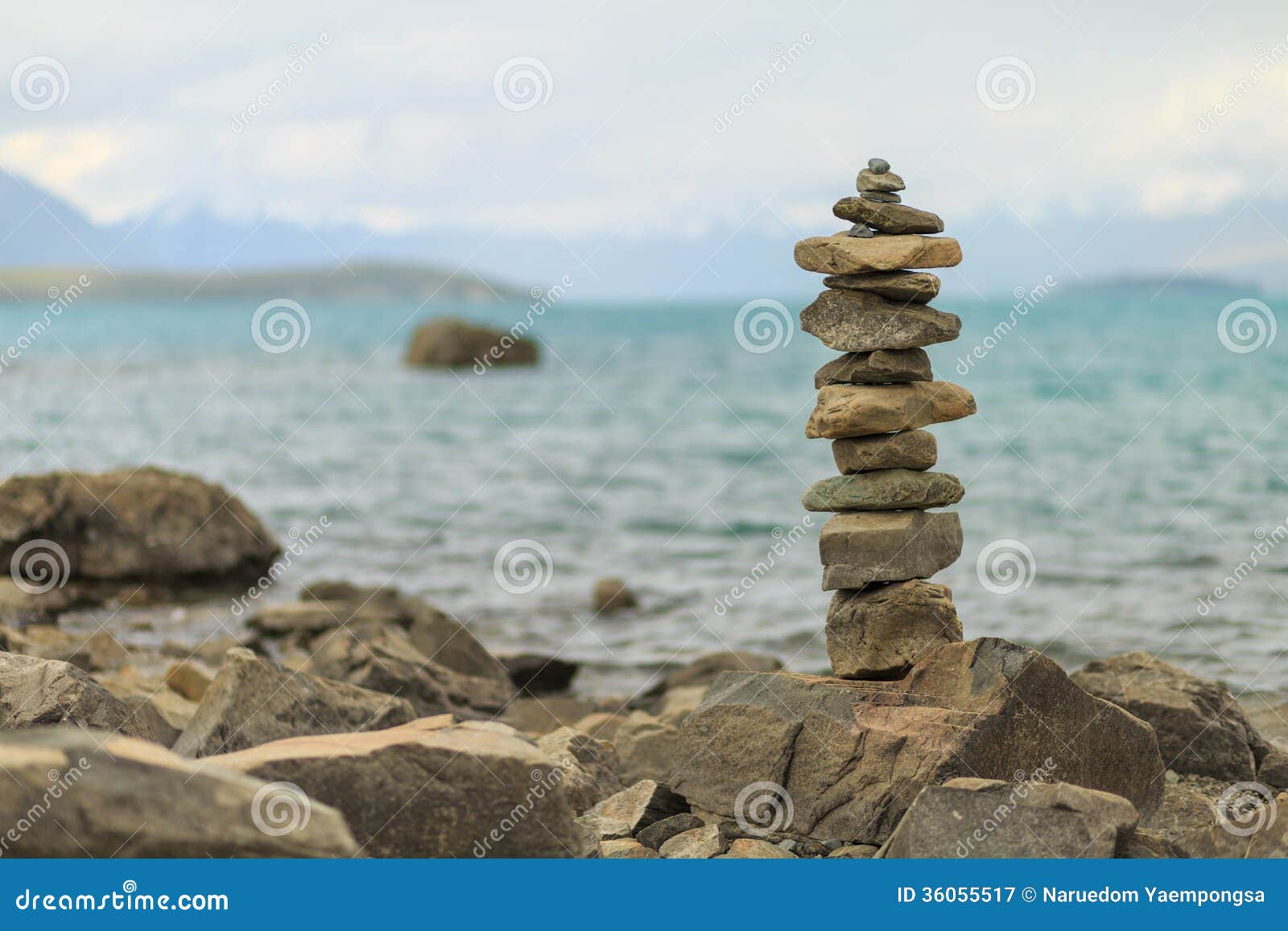 Tiny Stone Tower on the Lake Stock Image - Image of background, cloud ...