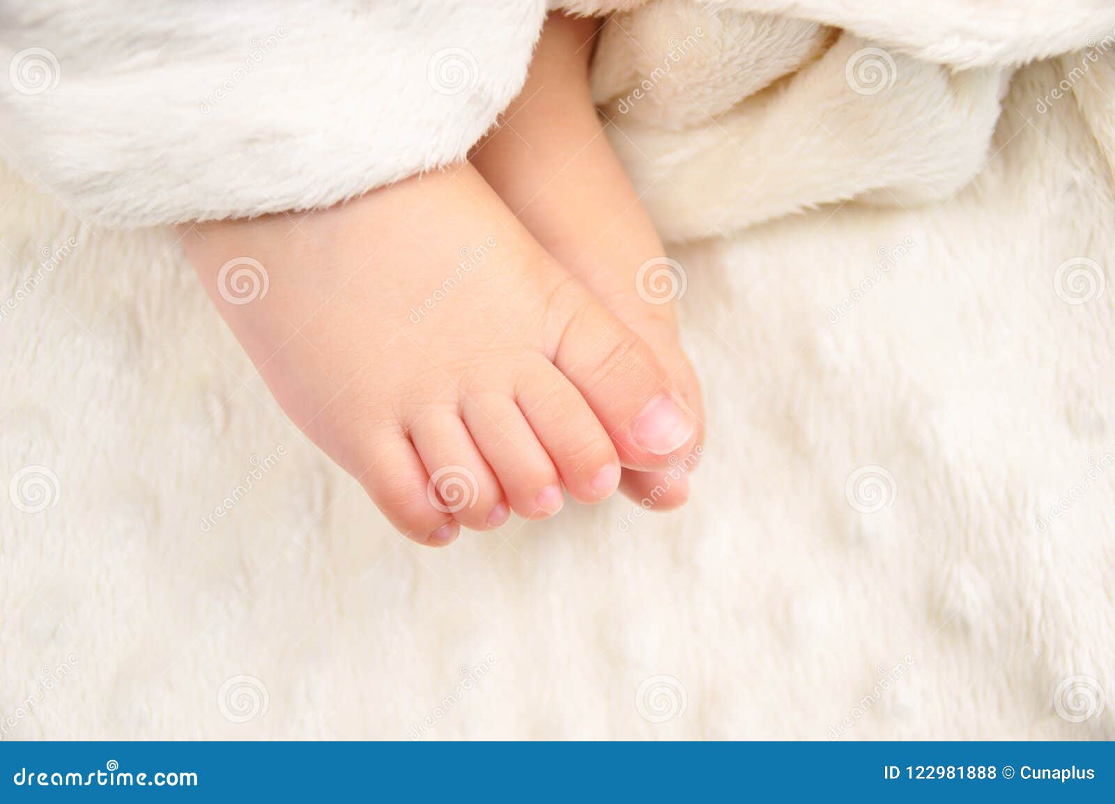 Tiny toes in bed stock photo. Image of development, male - 122981888