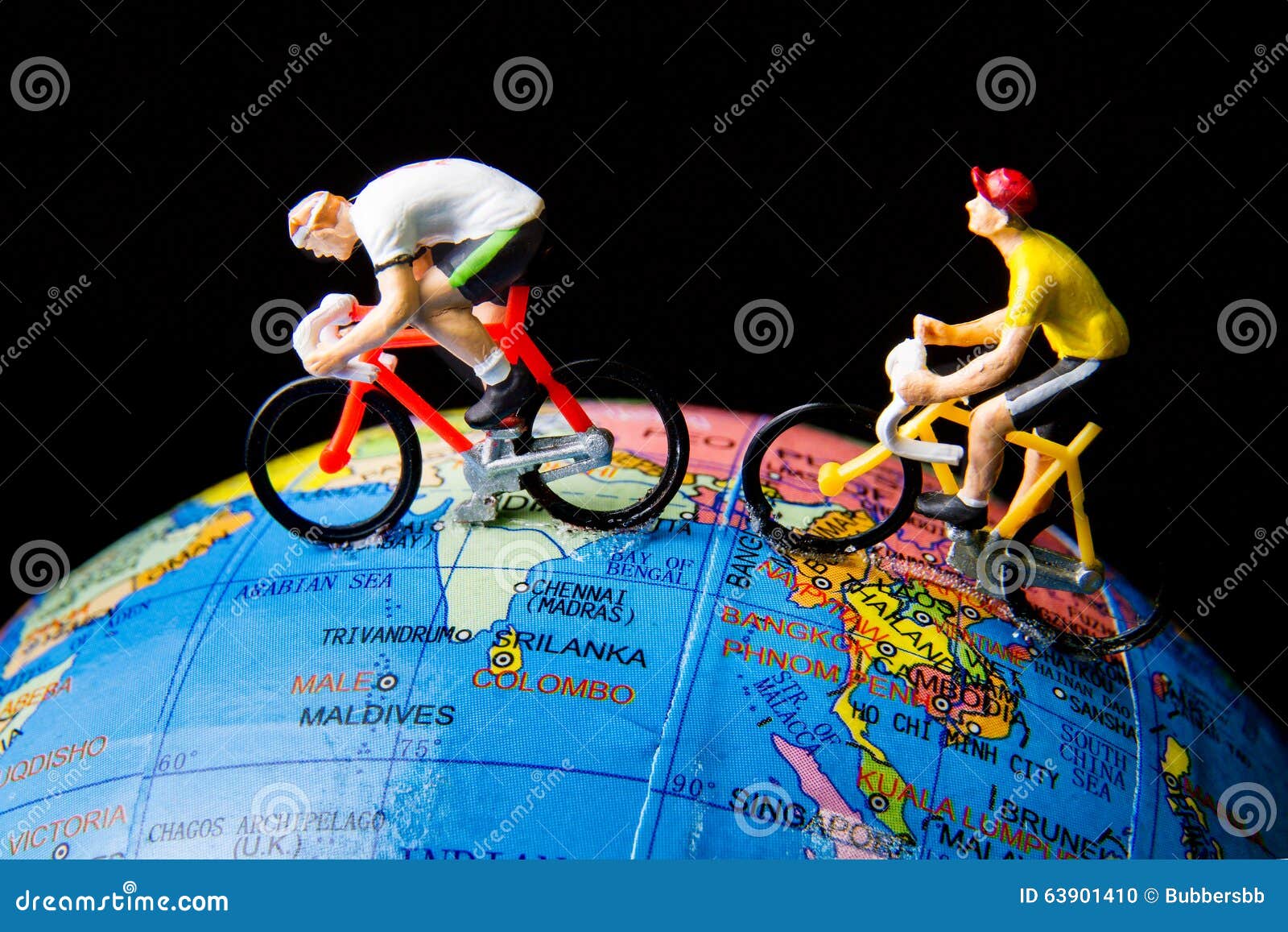 Tiny Toys Ride a Bicycle on the Globe World Map. Stock Photo - Image of ...