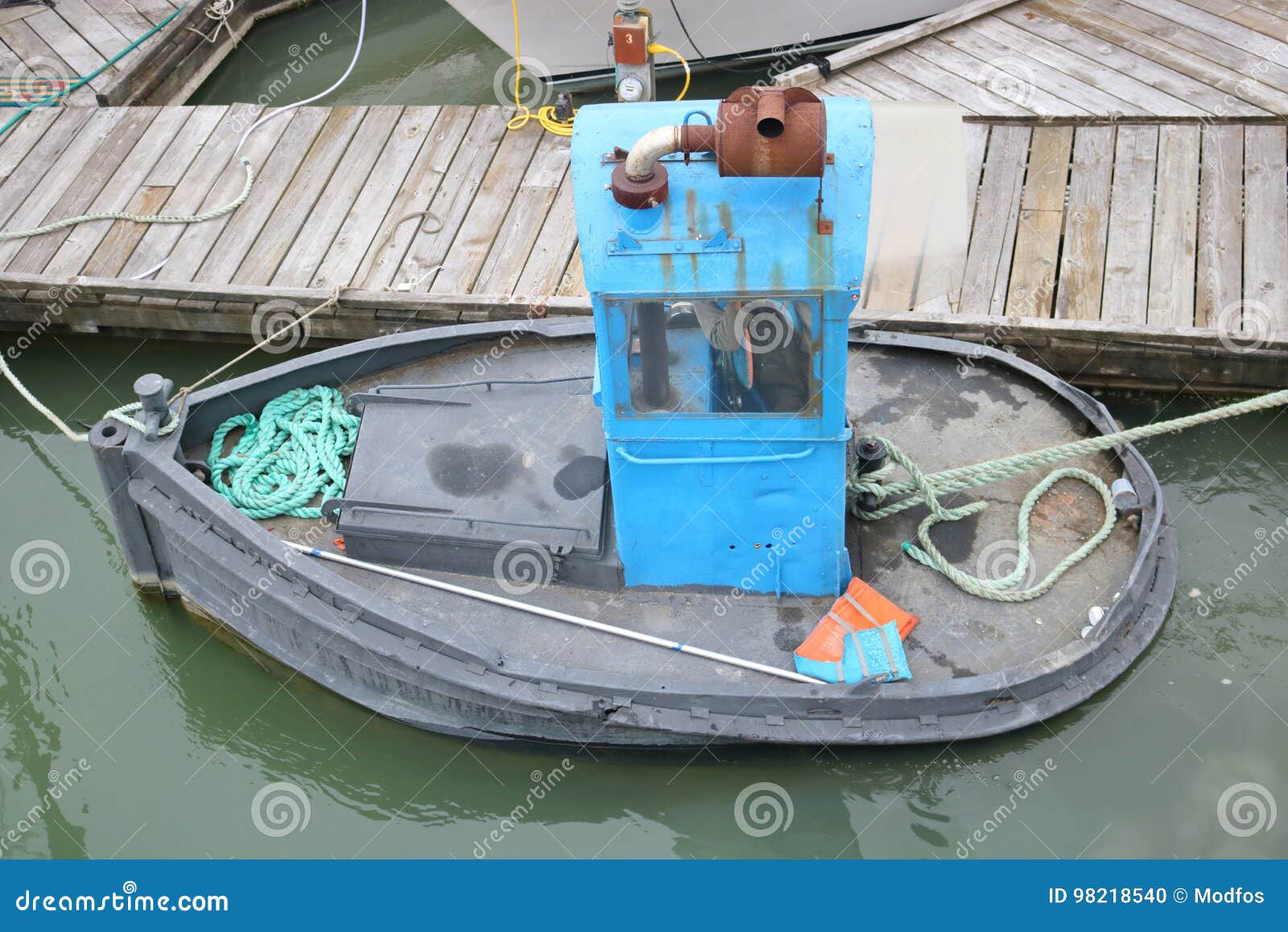 Tiny Tugboat and Dock stock photo. Image of metal, body - 98218540