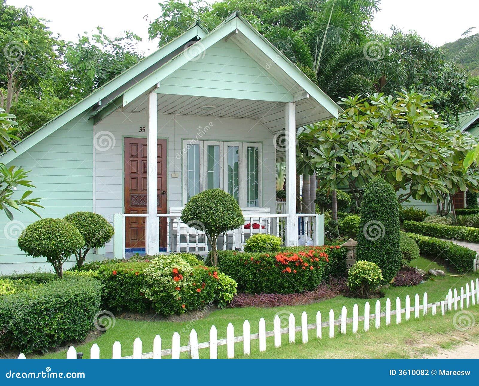 Tiny White Cottage stock photo. Image of colorful, landscaped - 3610082