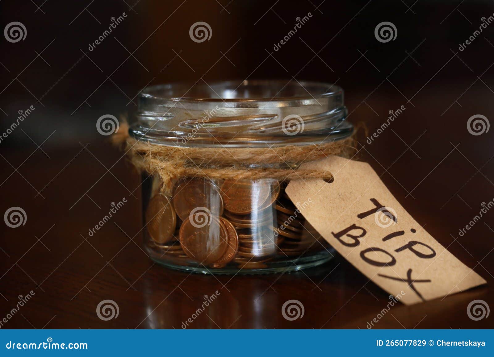 Tip Box Full of Coins on Wooden Table in Cafe, Closeup Stock Image ...