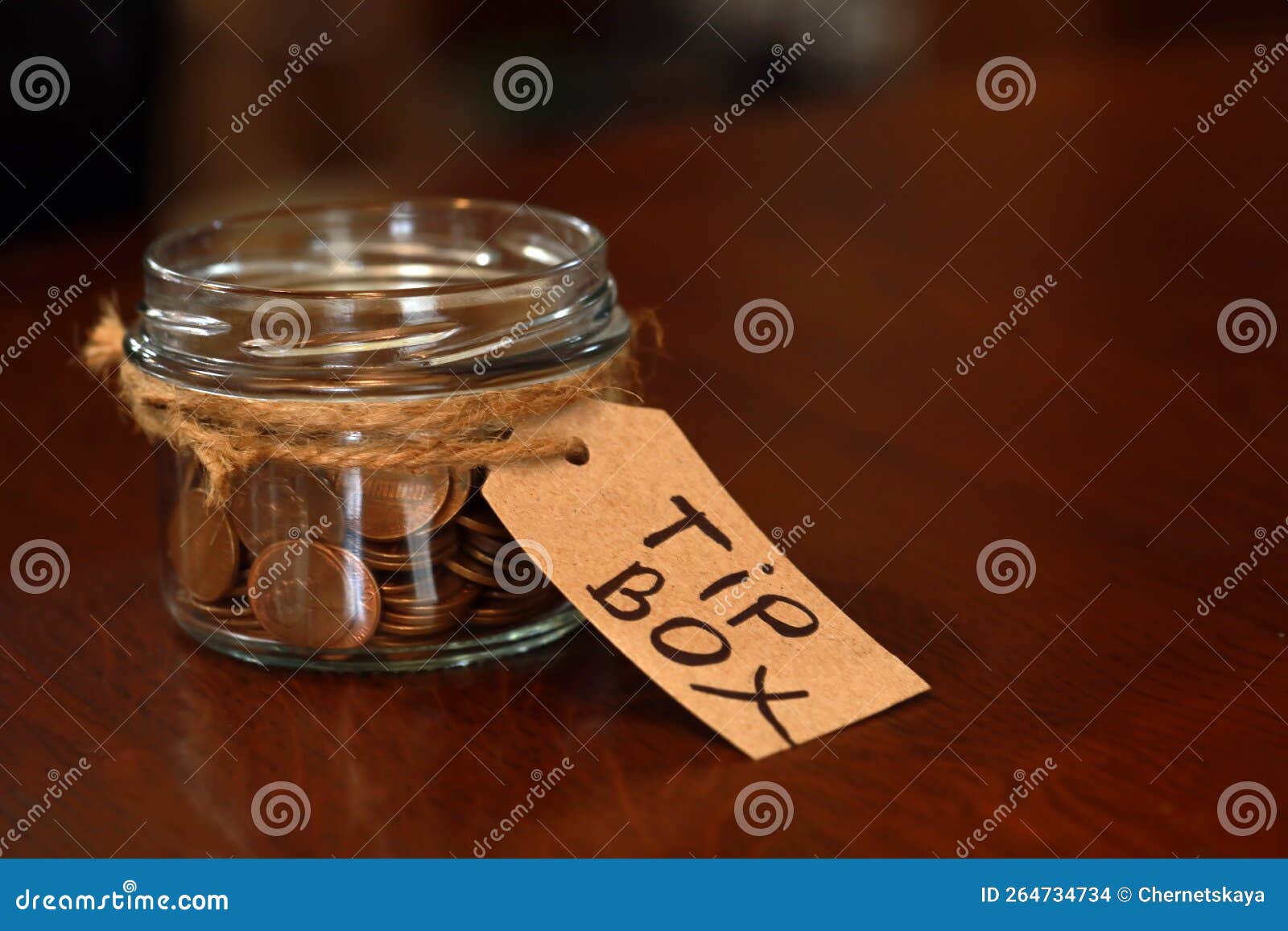 Tip Box Full of Coins on Wooden Table in Cafe, Space for Text Stock ...