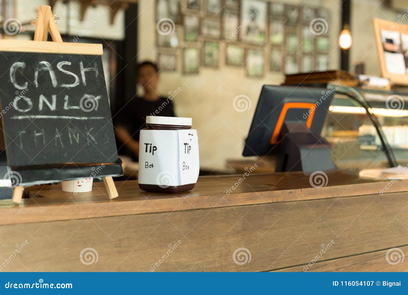 Tip box on wood counter stock image. Image of focus - 116054107