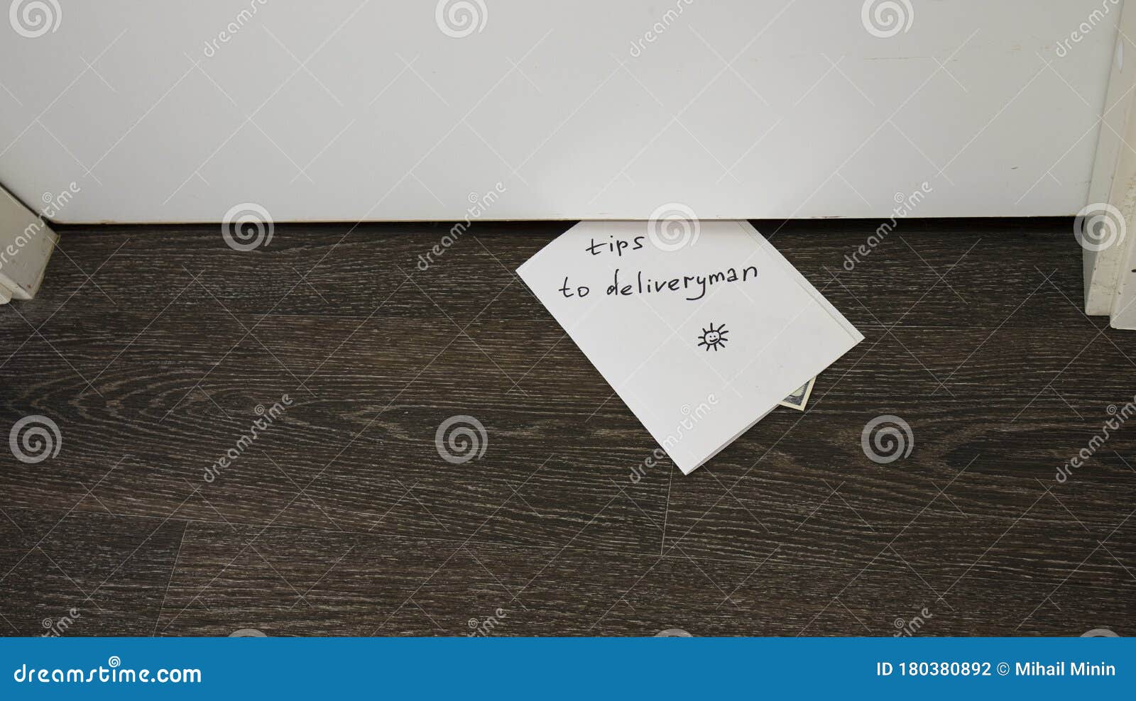 Tip the Courier Delivery in an Envelope Under the Door Stock Photo ...