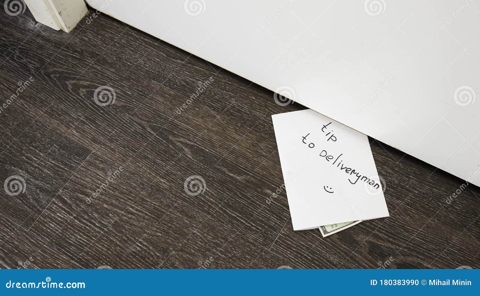 Tip the Courier Delivery in an Envelope Under the Door Stock Photo ...