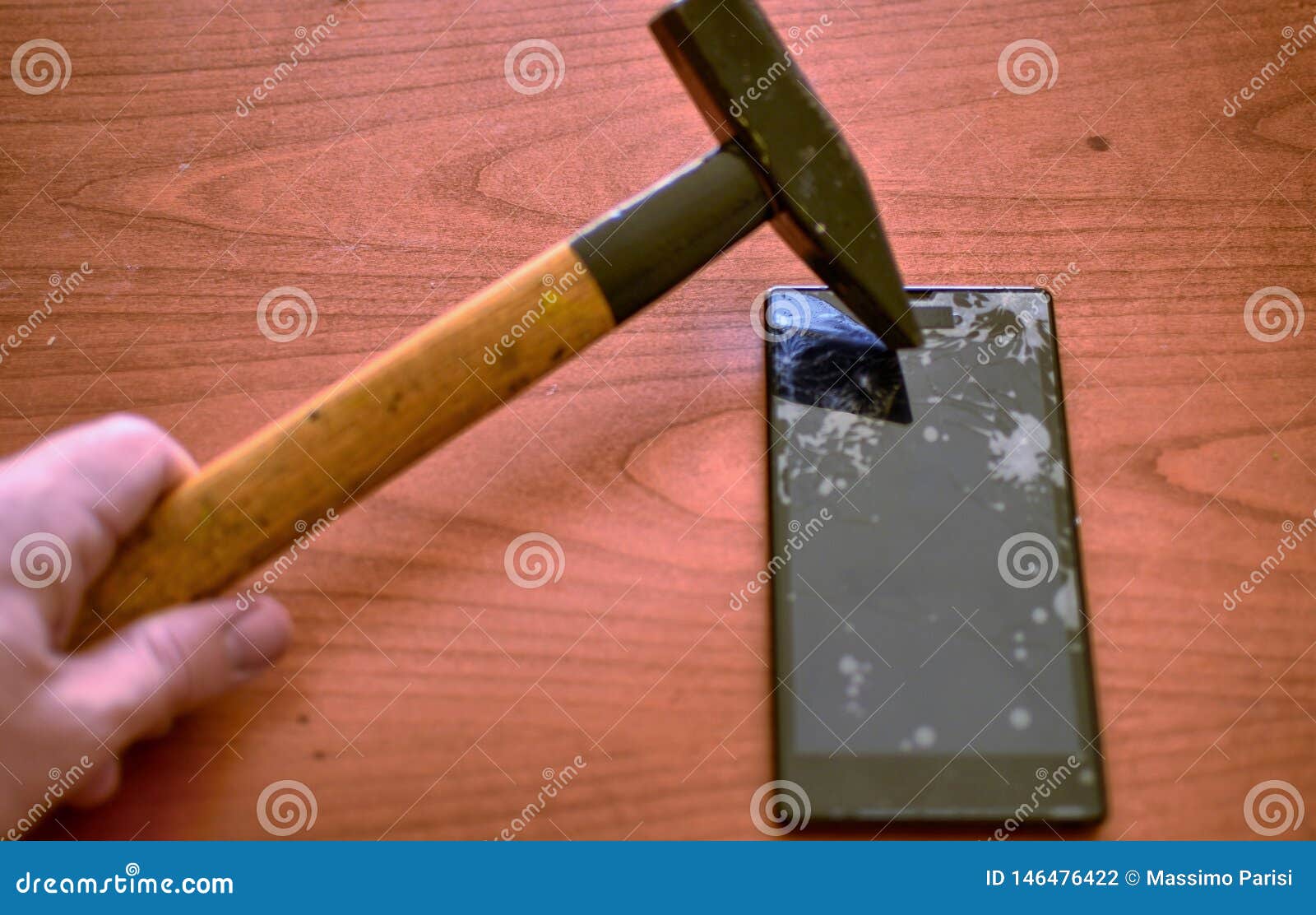The Tip of the Hammer Hit the Screen of the Smartphone Stock Photo ...