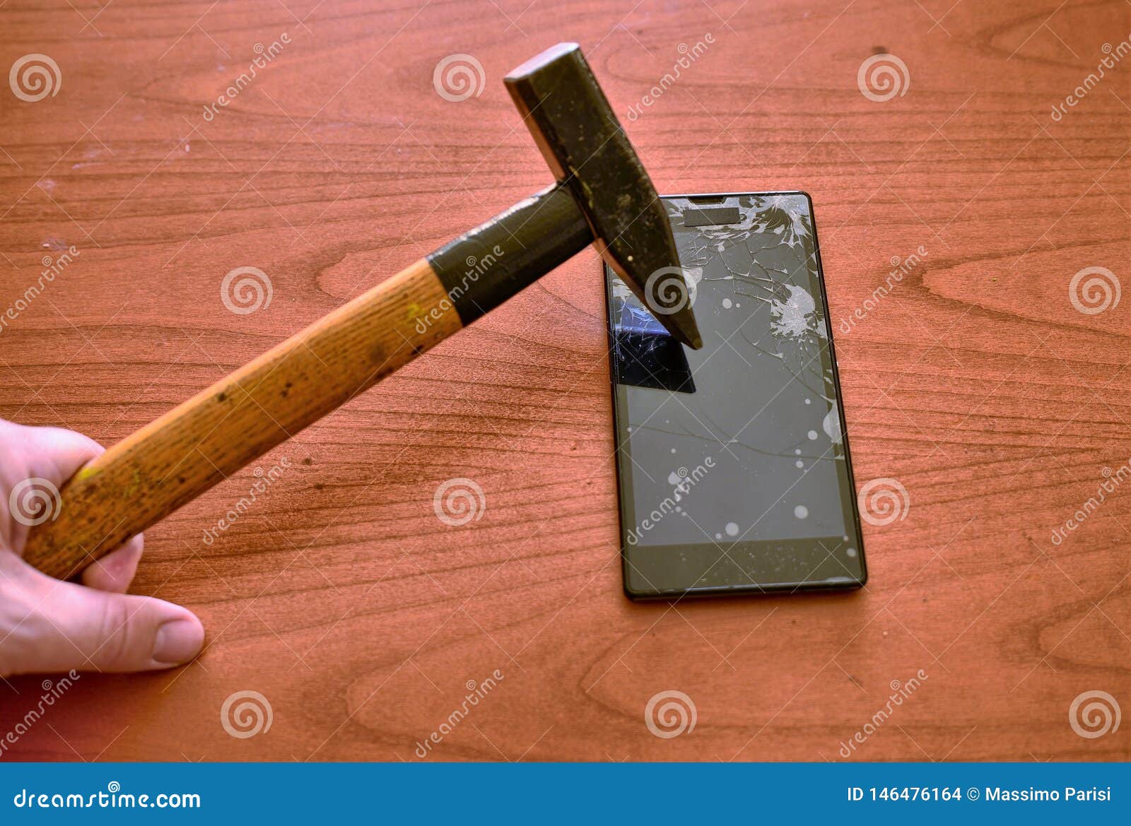 The Tip of the Hammer Hit the Screen of the Smartphone Stock Photo ...