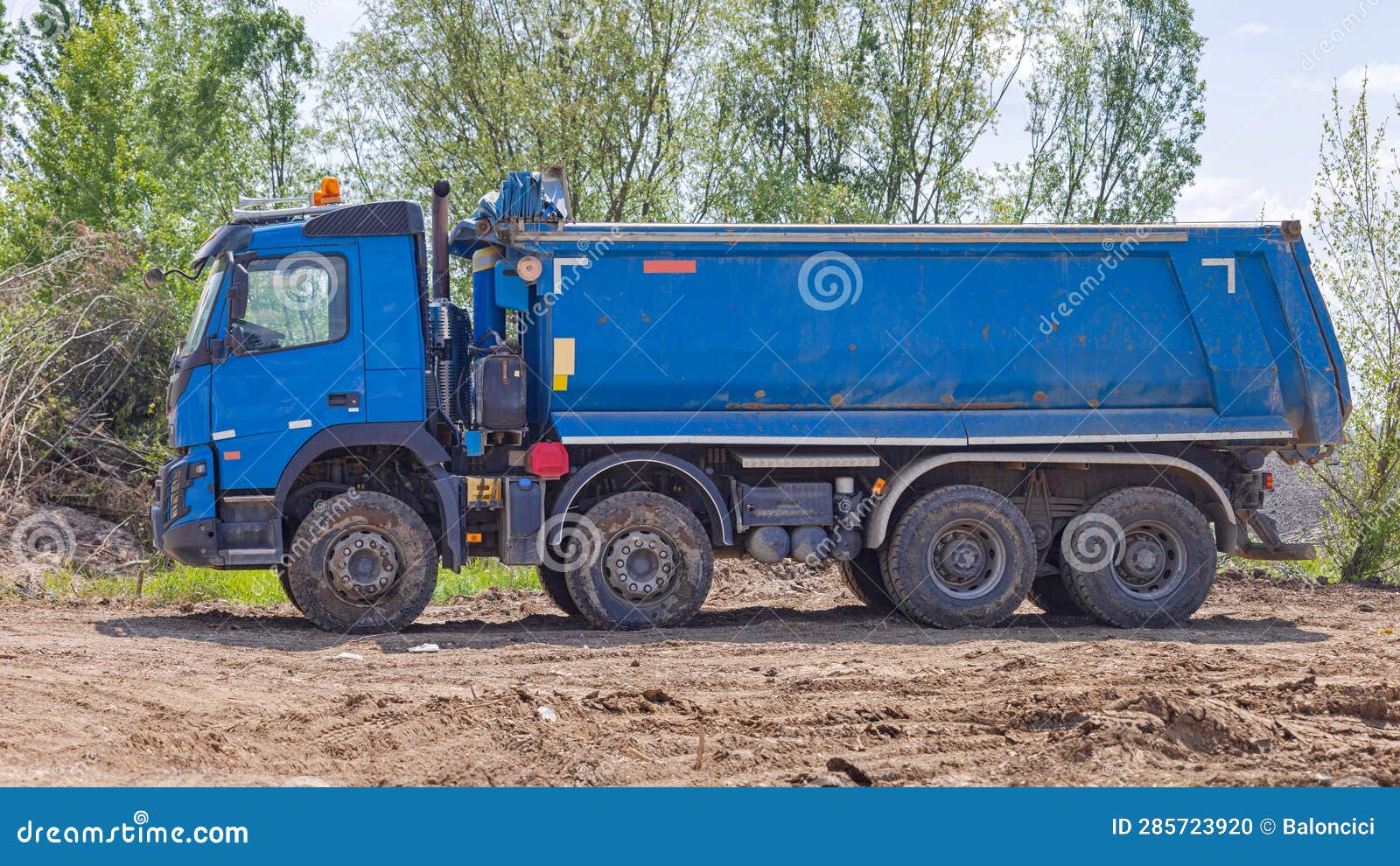 Blue Tipper Big Rig Semi Truck With Tip Trailer Running On The ...