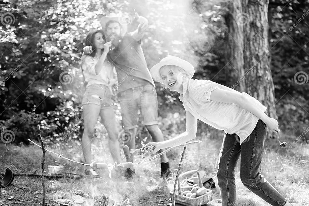 Tips Every Camper Should Know About Campfire Cooking Girl In Straw Hat Cooking Food At Campfire
