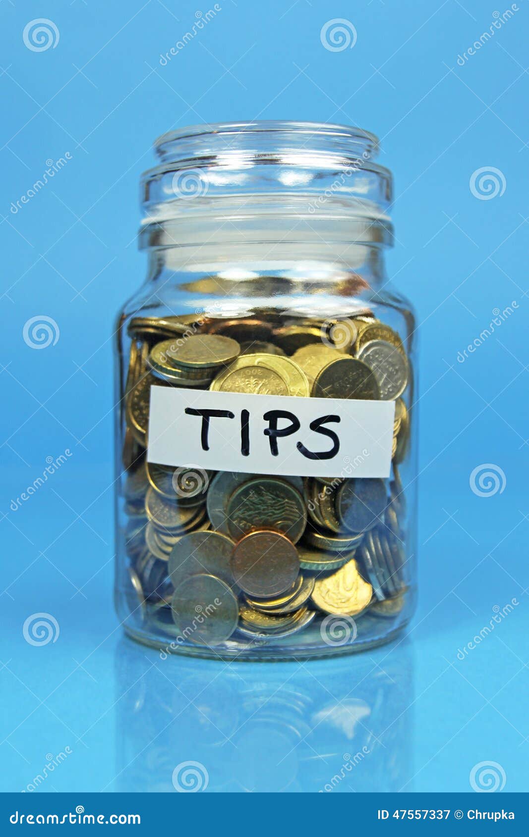 Tips jar filled with coins stock image. Image of metal - 47557337